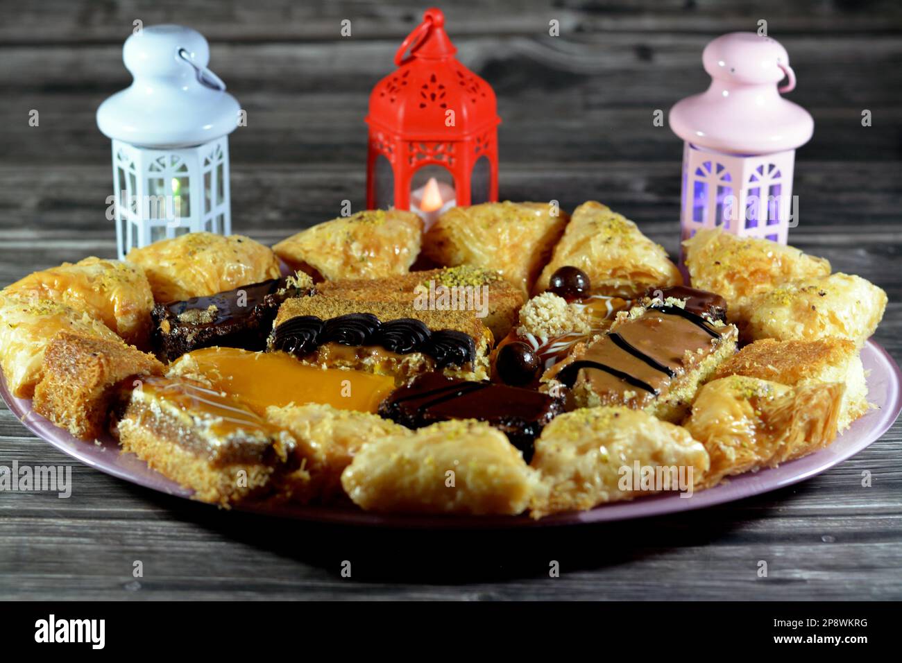 Eastern desserts with Ramadan lanterns, Konafa covered with mango ...