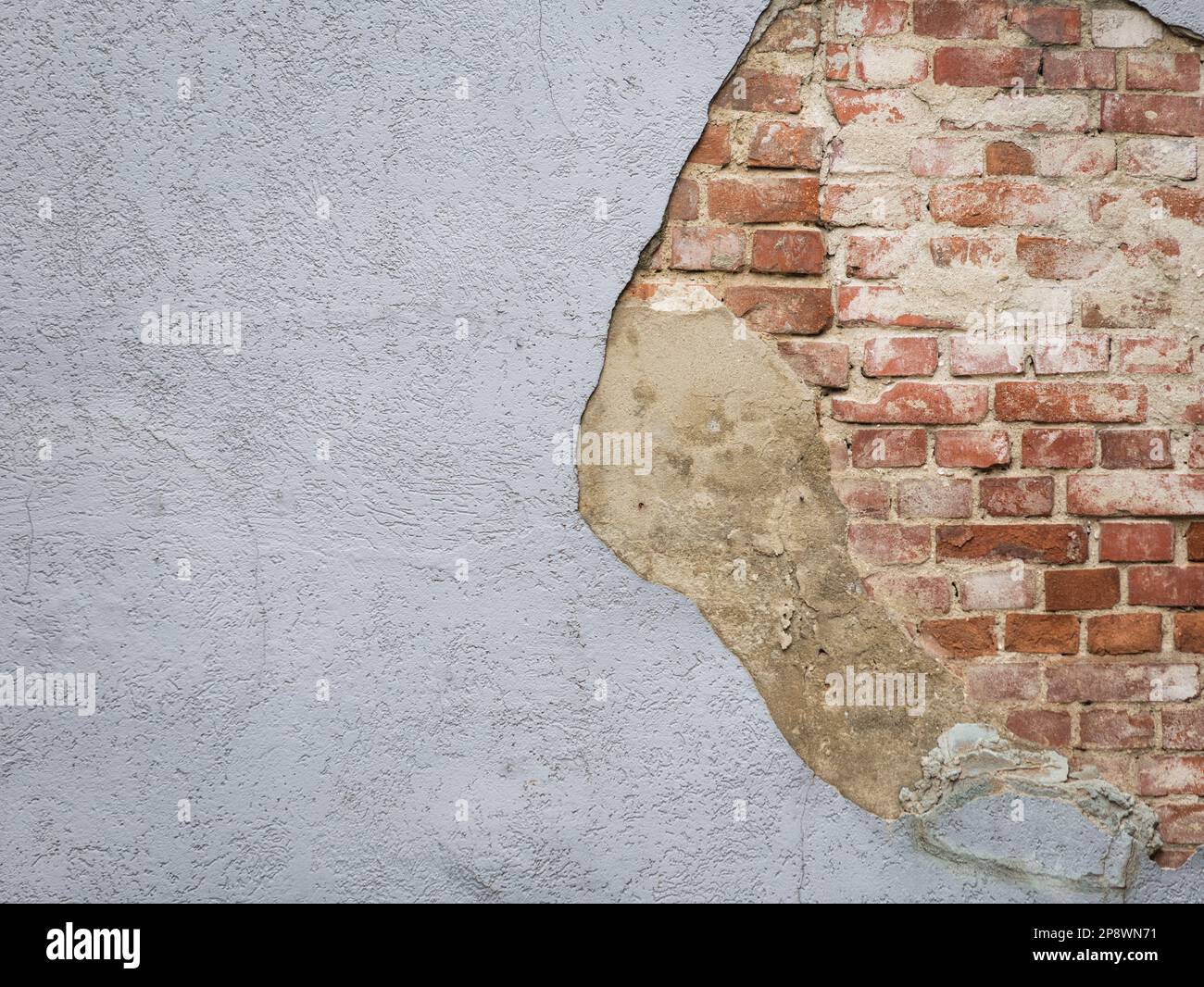 Plaster peeling from an old red brick wall Stock Photo - Alamy