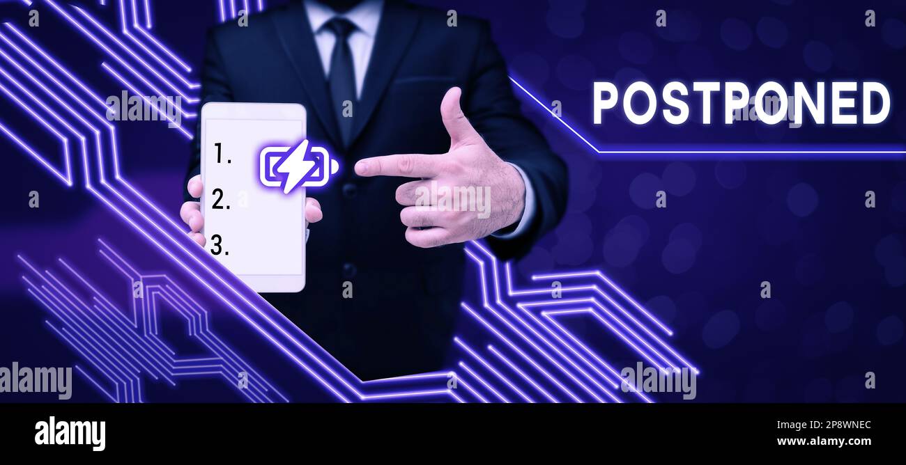 Hand writing sign Postponed. Word for to place later in order of ...