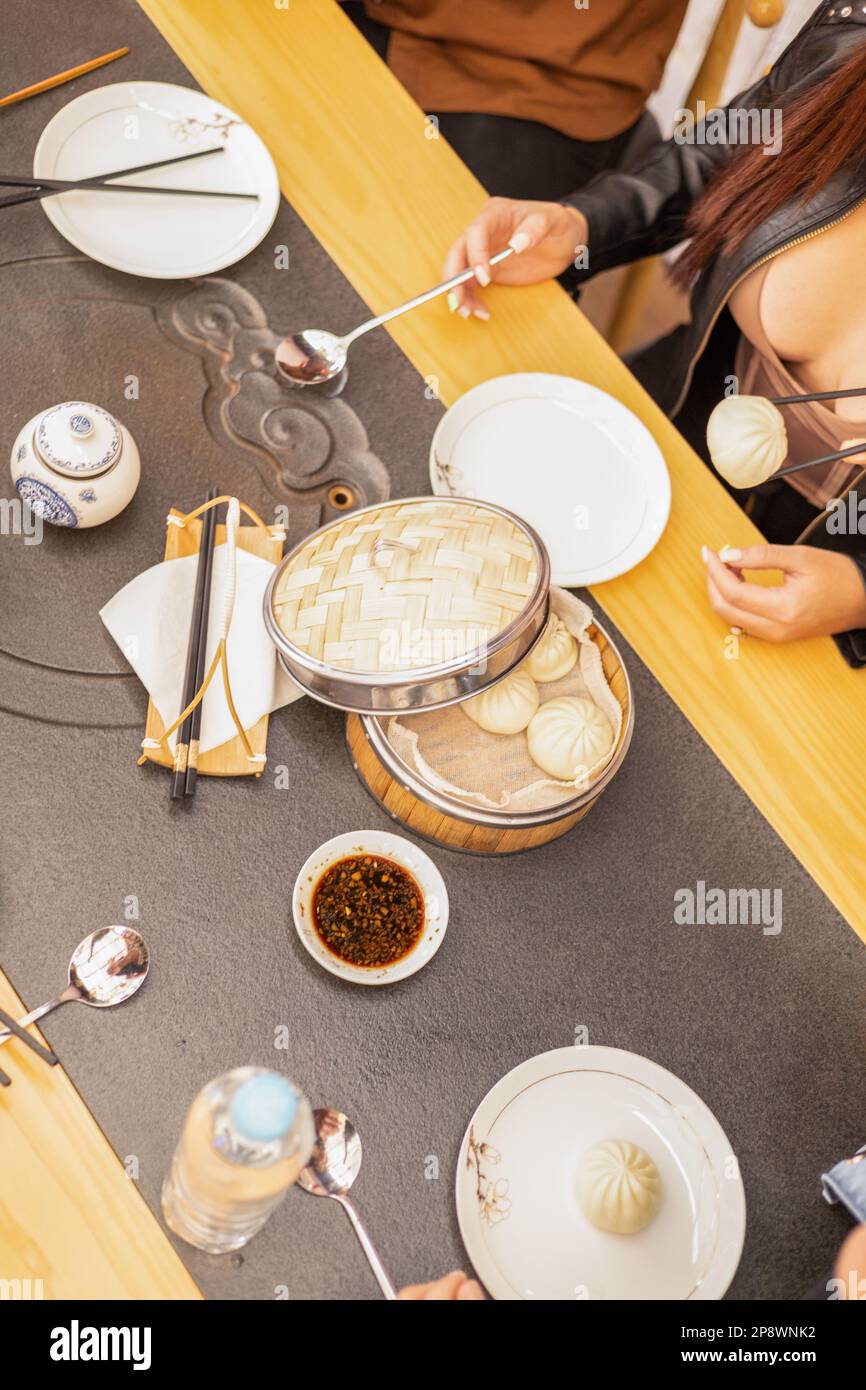 restaurant lifestyle, table served with asian food, kitchen utensils ...