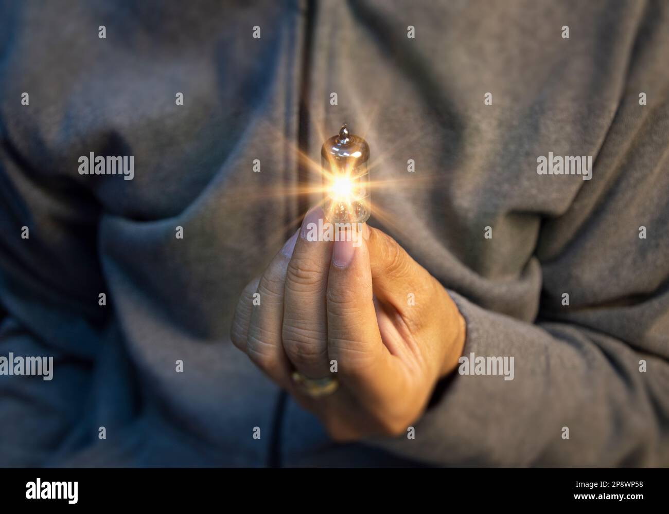 Human hand holding light bulb, idea, innovation and inspiration with ...