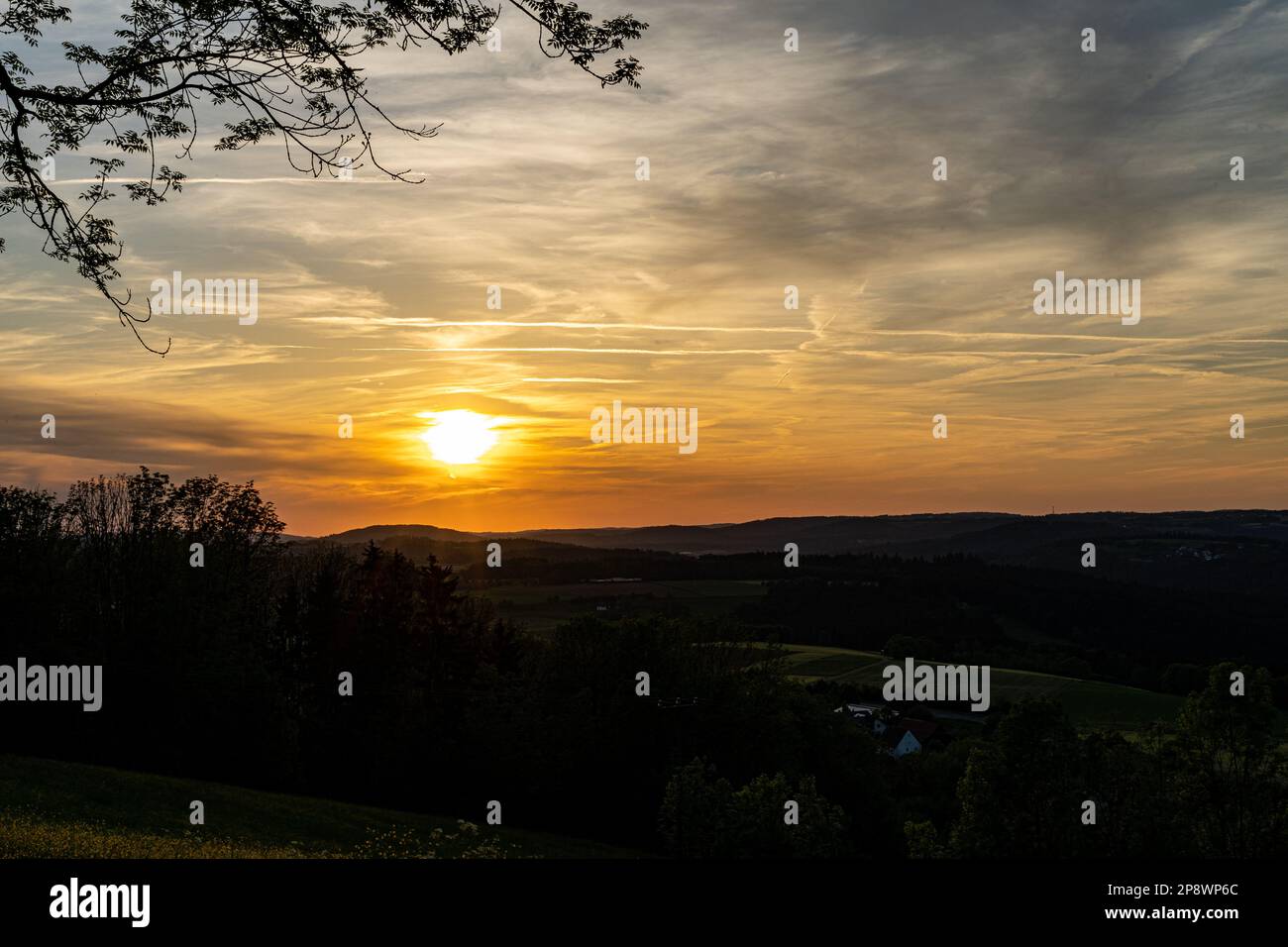 Sunset and landscape with fields, hills and golden light Stock Photo ...