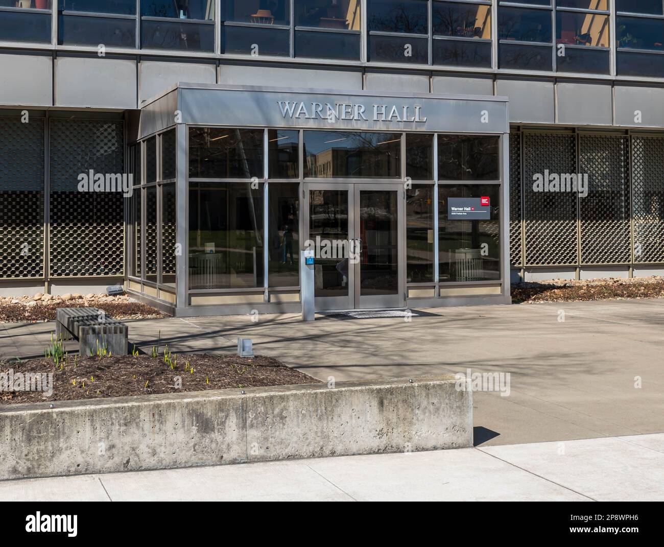 The entrance to Warner Hall, an office building on the campus of ...