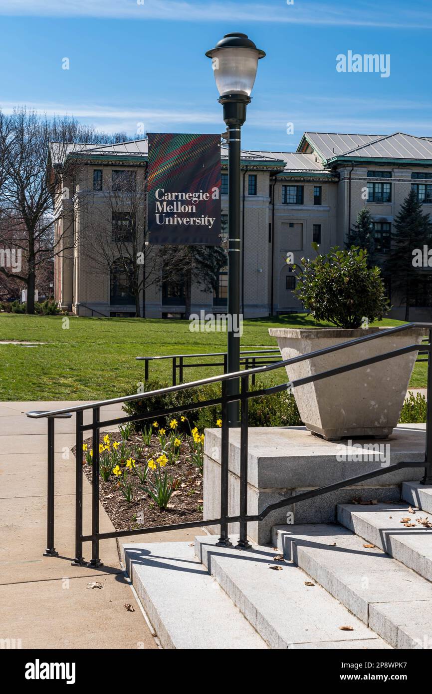 A Carnegie Mellon University sign attached to a lamp post on campus in ...