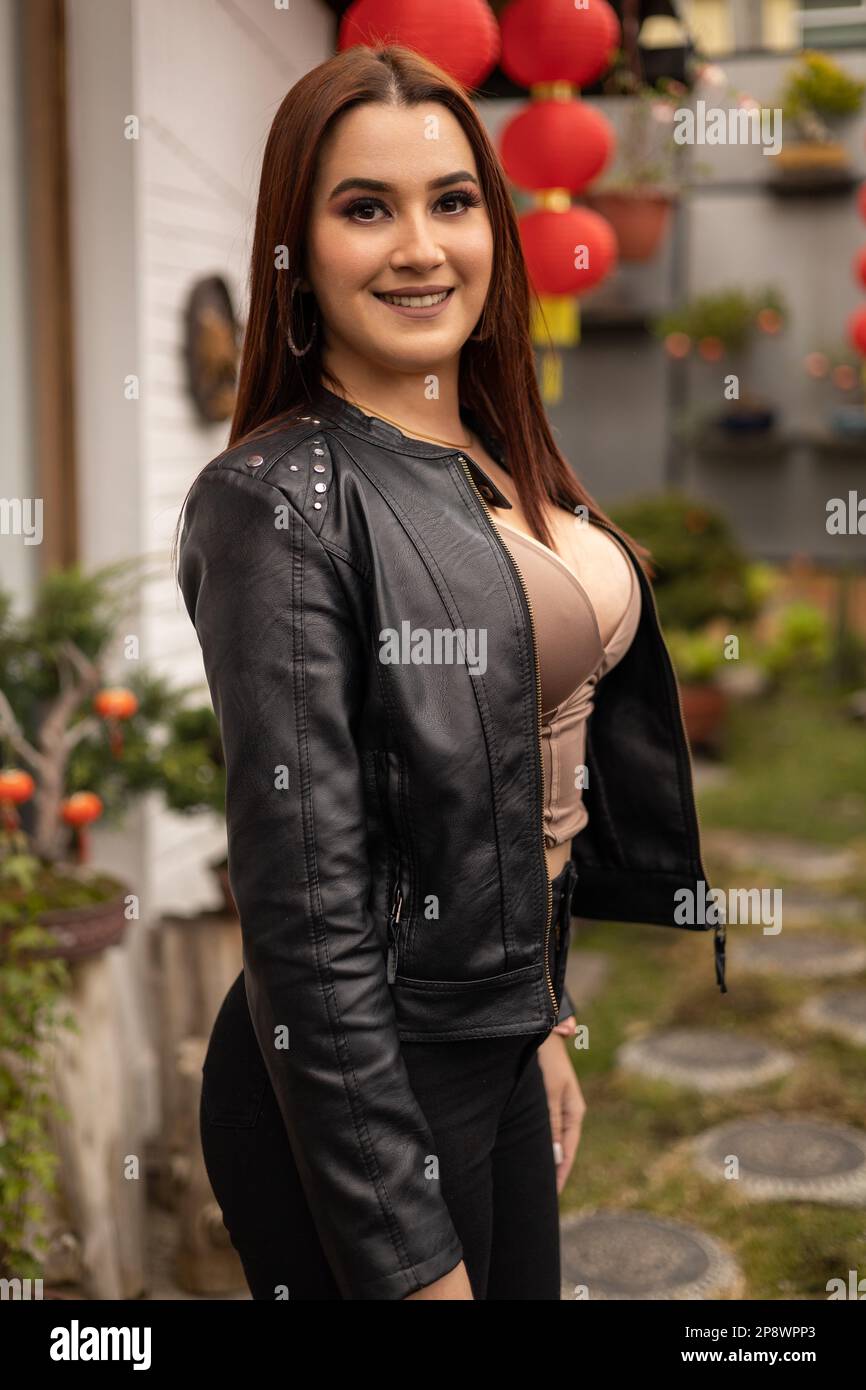 female model posing standing and wears a jacket and clothes in trend ...