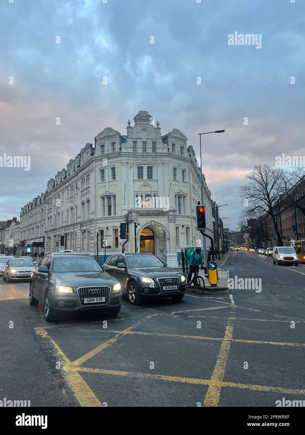 A vibrant urban scene featuring the busy city street of Cardiff filled ...