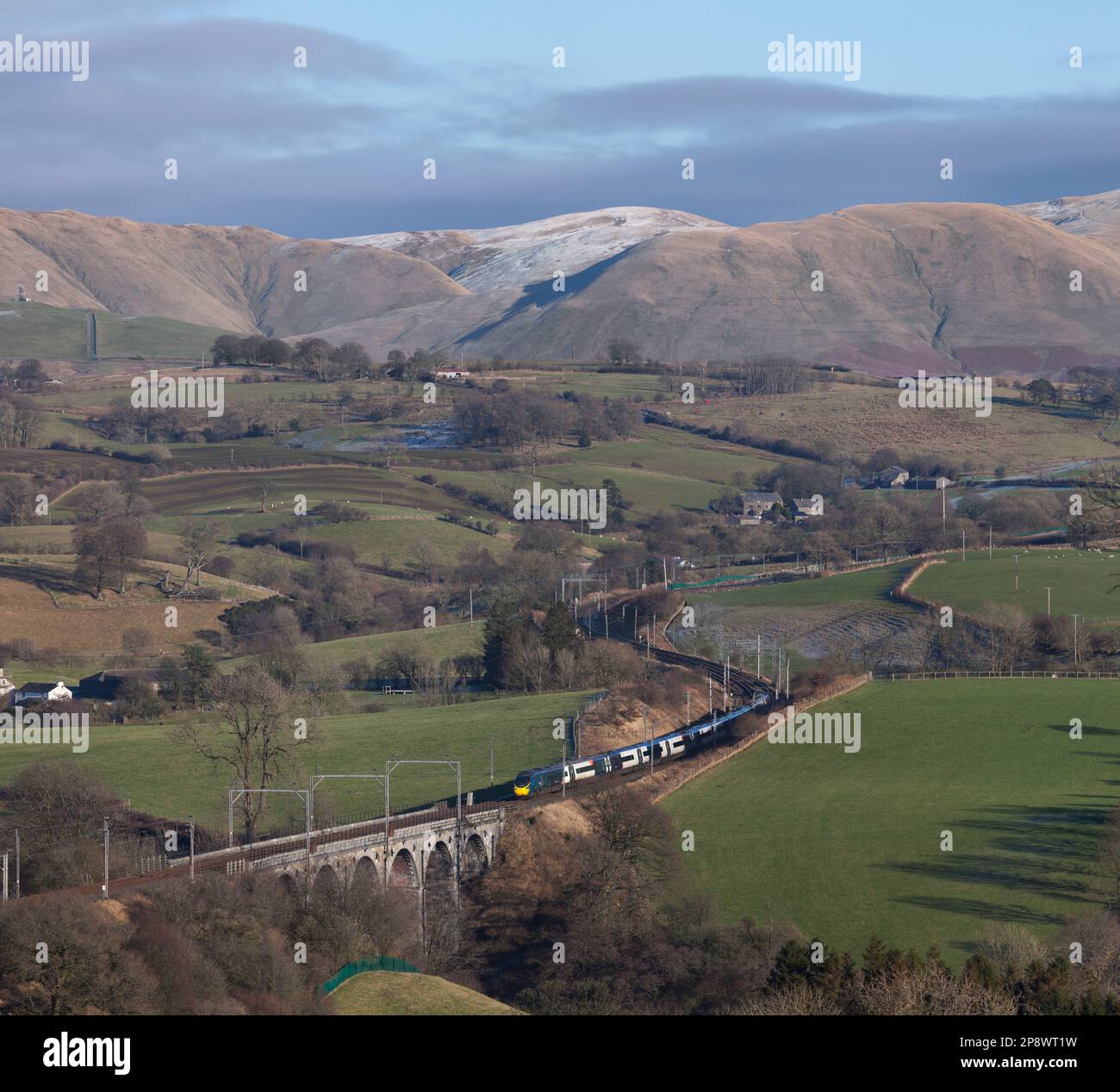 With the Howgills behind an Avanti West Coast Alstom Pendolino train ...