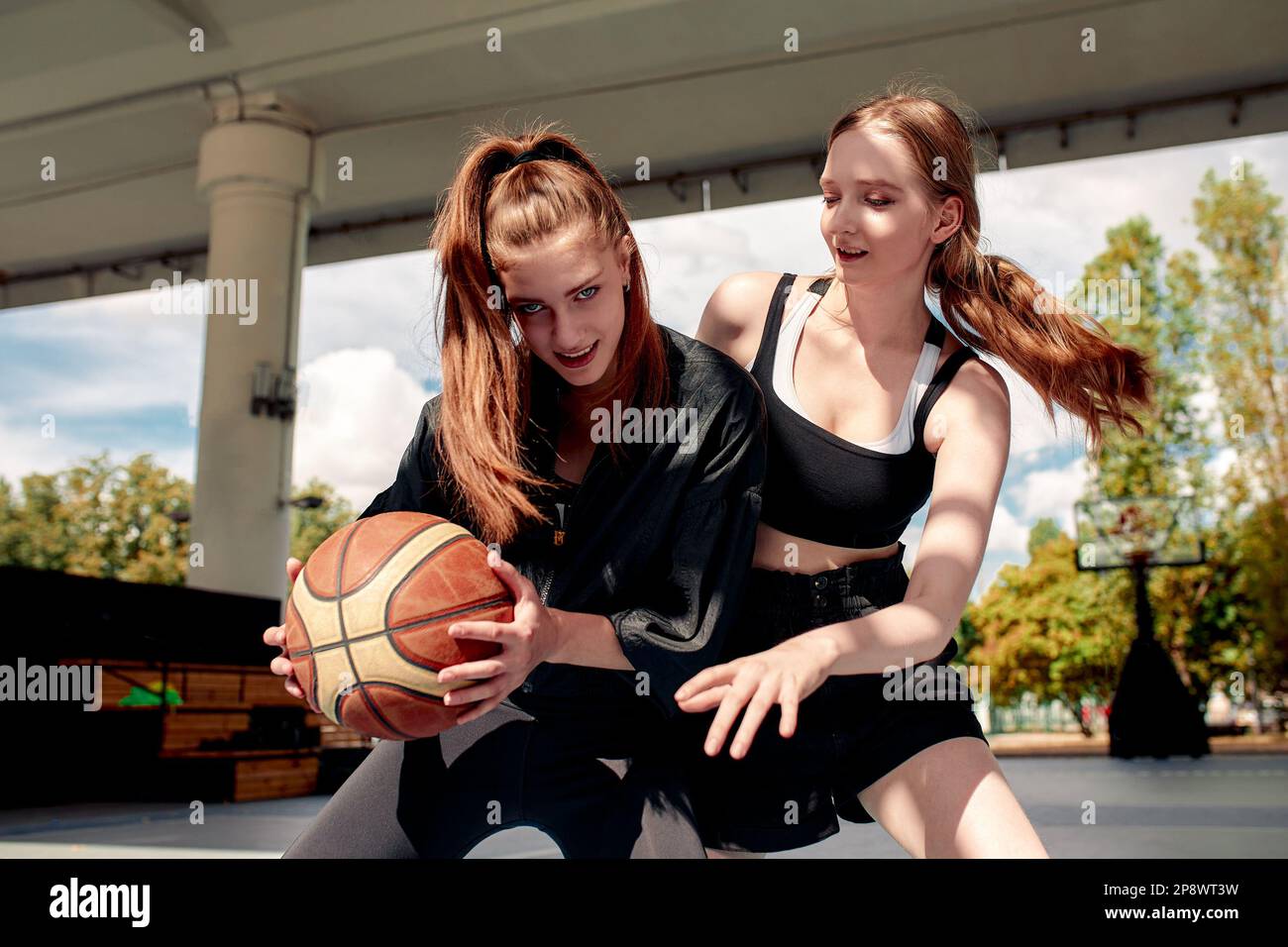 Bonding Through Basketball: Two Friends on court Stock Photo - Alamy