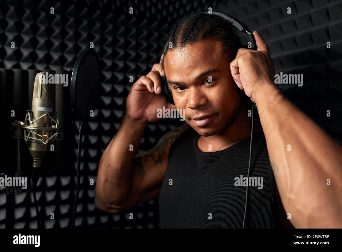 African American at the recording studio in headphones reads rap Stock ...