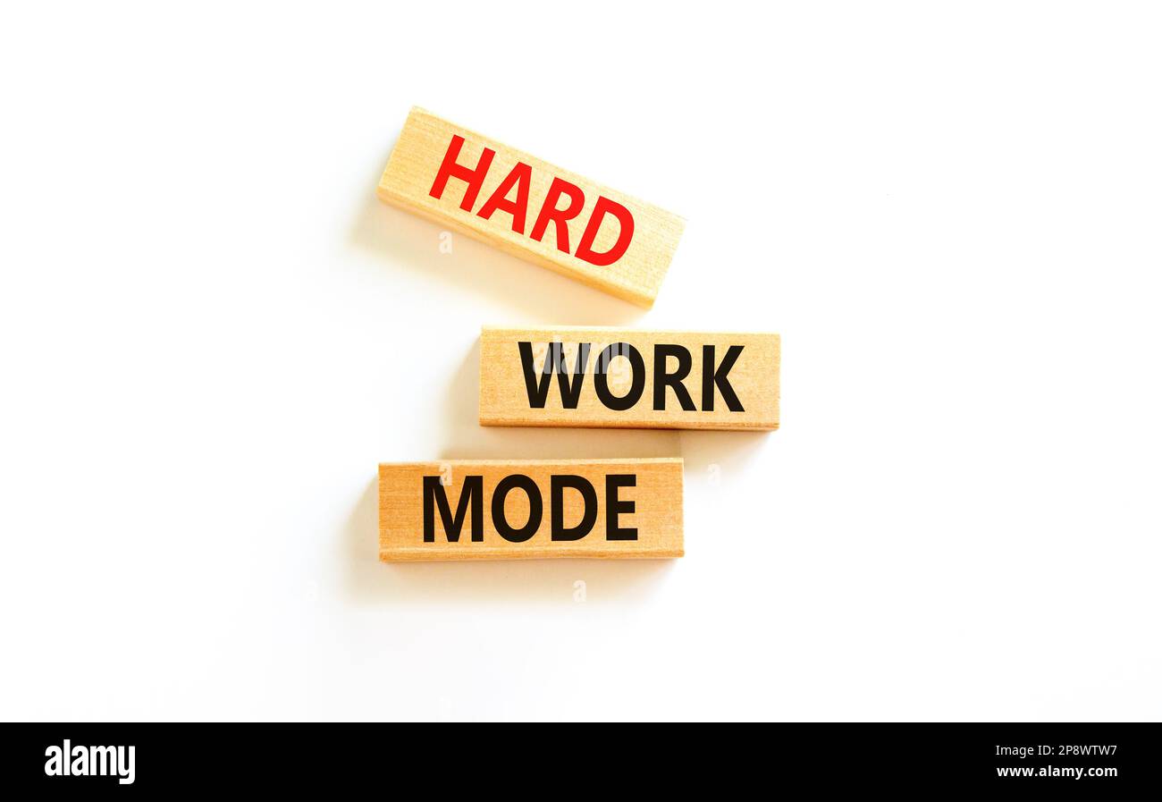 Hard work mode symbol. Concept words Hard work mode on wooden block on ...
