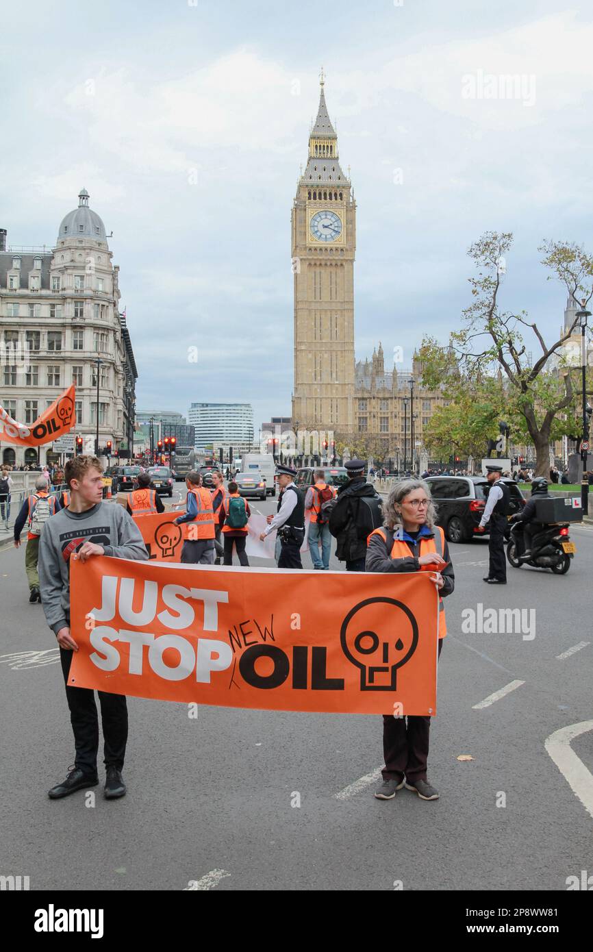 London, UK. 31 October 2022. Just Stop Oil demonstrators block the road ...