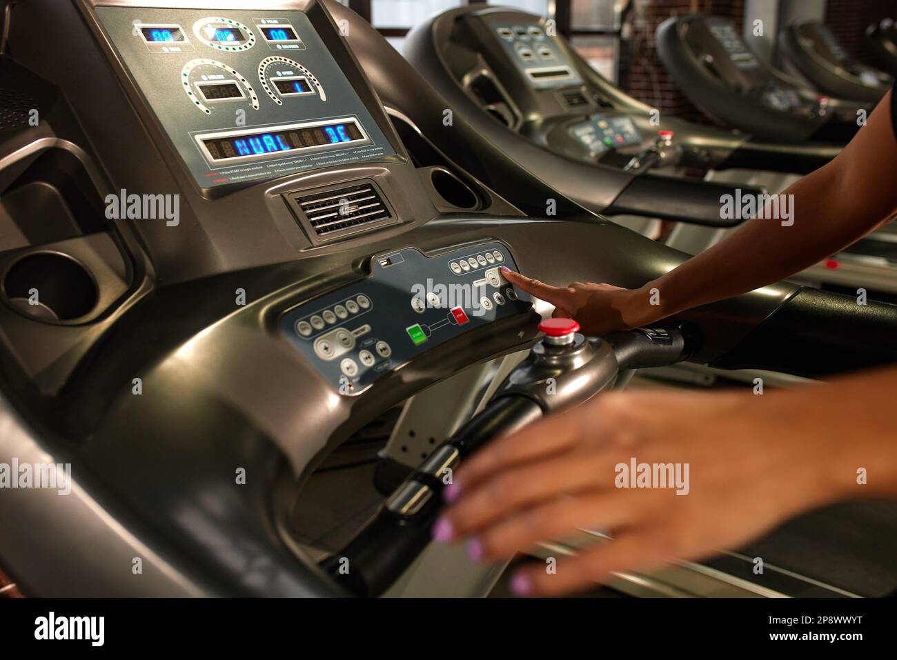 I am ready to workout Close up photo of woman hand pushing a start ...