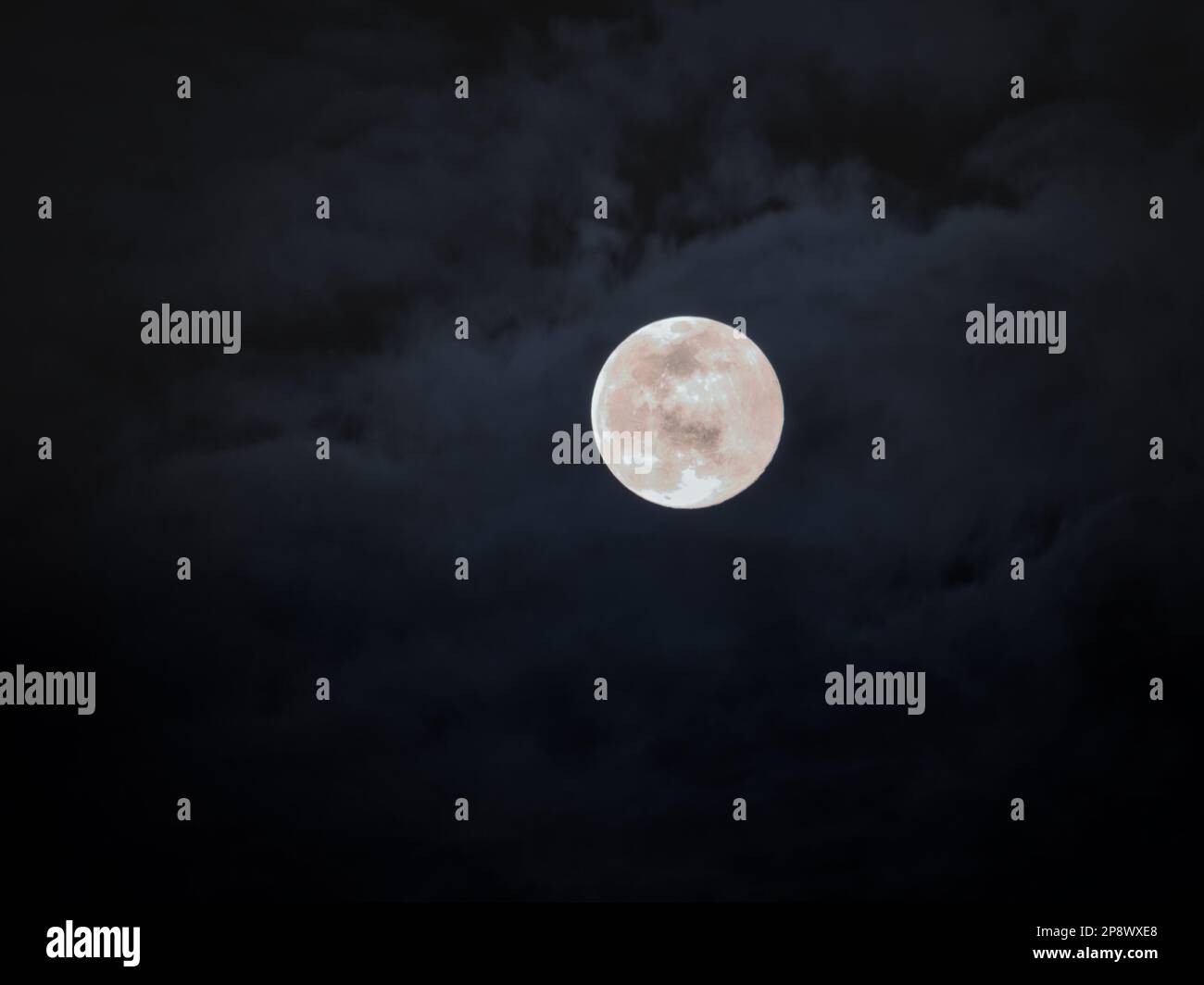 Full moon with large amounts of fast moving cloud cover near Spring ...