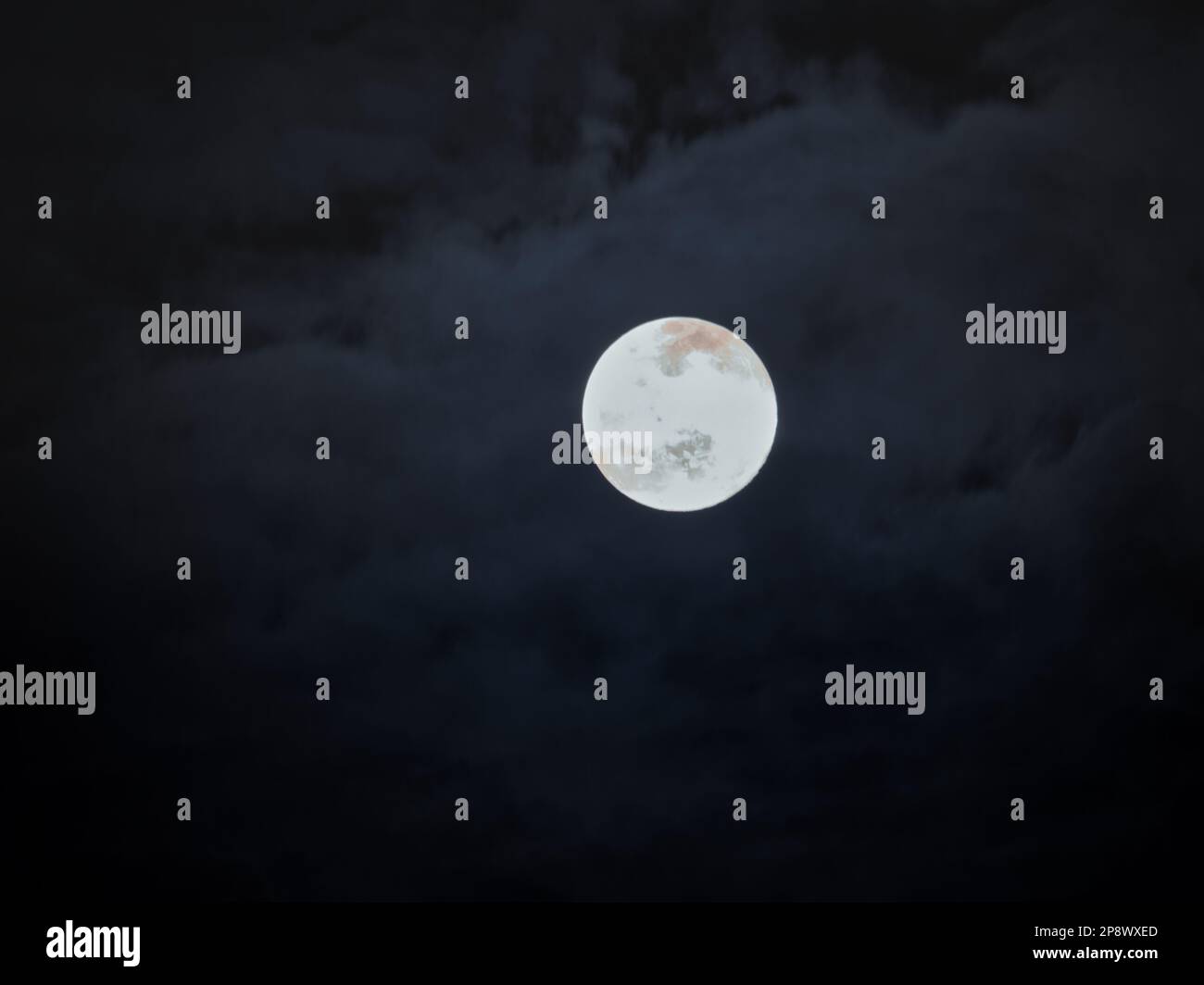 Full moon with large amounts of fast moving cloud cover near Spring ...
