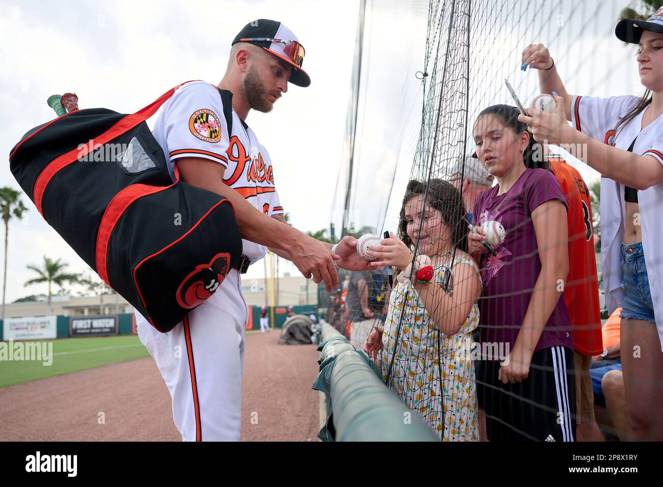 Baltimore Orioles Connor Norby (94) signs autographs before a spring ...