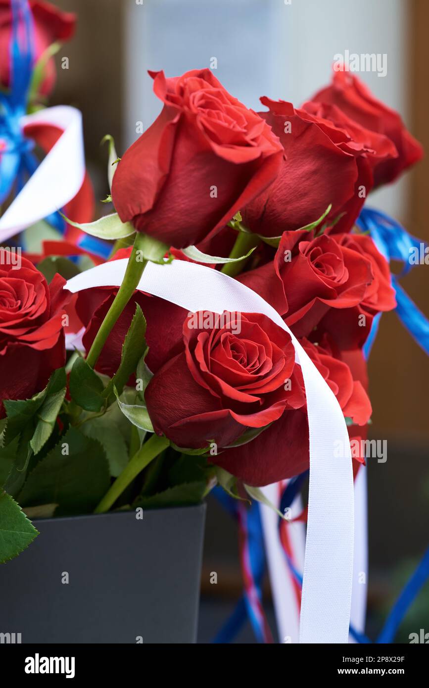 Rose flowers with red, white and blue ribbons Stock Photo - Alamy