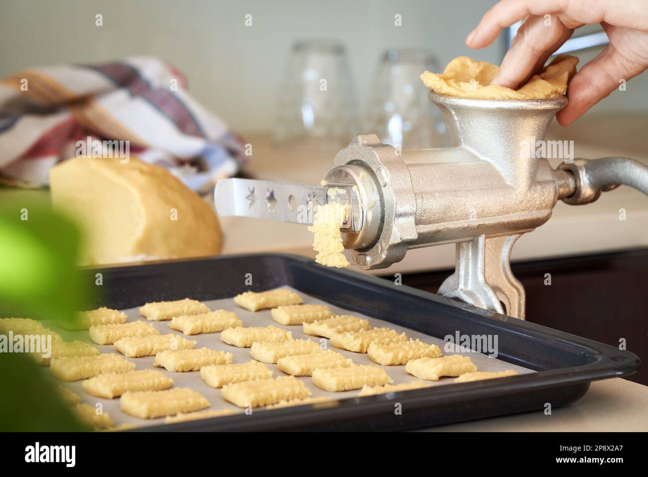 Pressing pastry dough through hi-res stock photography and images - Alamy