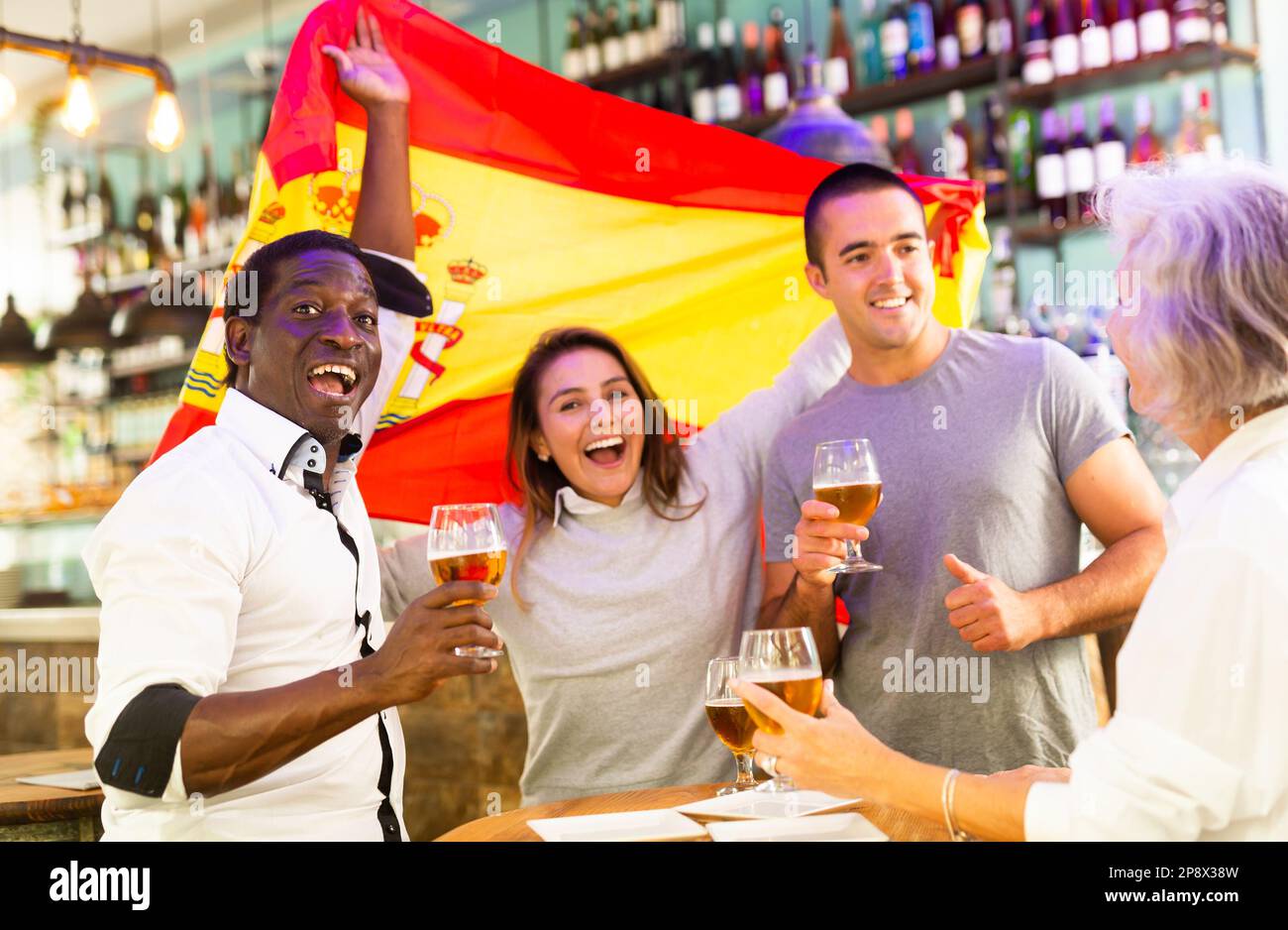 Spanish male and female soccer football fans celebrating championship ...