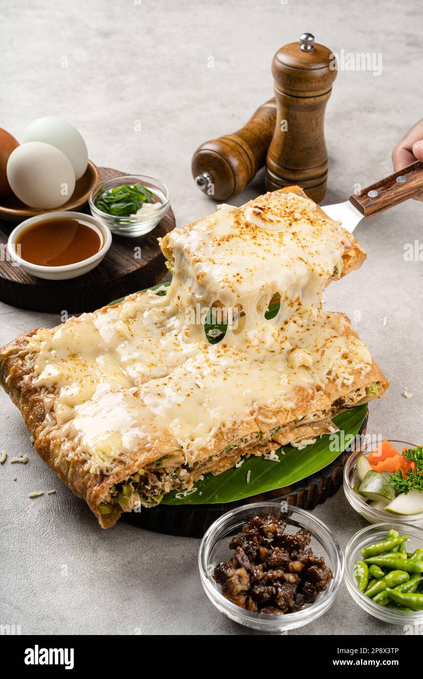 Martabak telur is indonesian street food, made with savory pan fried ...