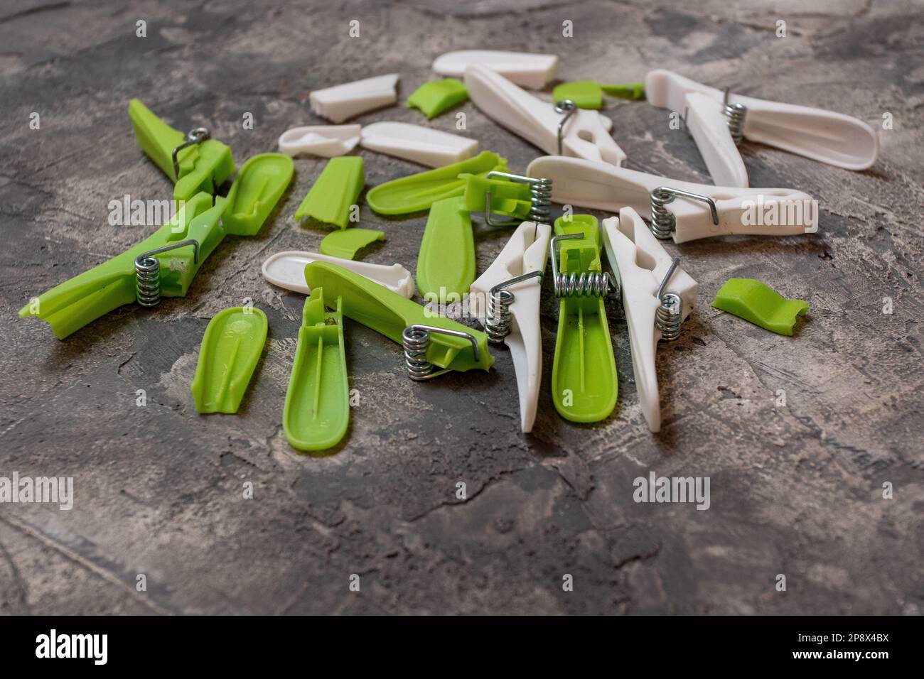 Remains of plastic clothes pegs cheaply made so they snap and break in ...