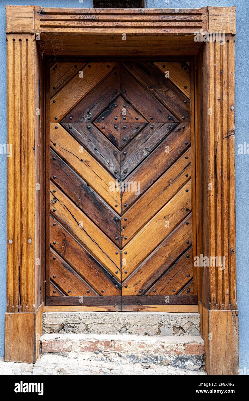 Old door of a historical building with steel door fittings Stock Photo ...