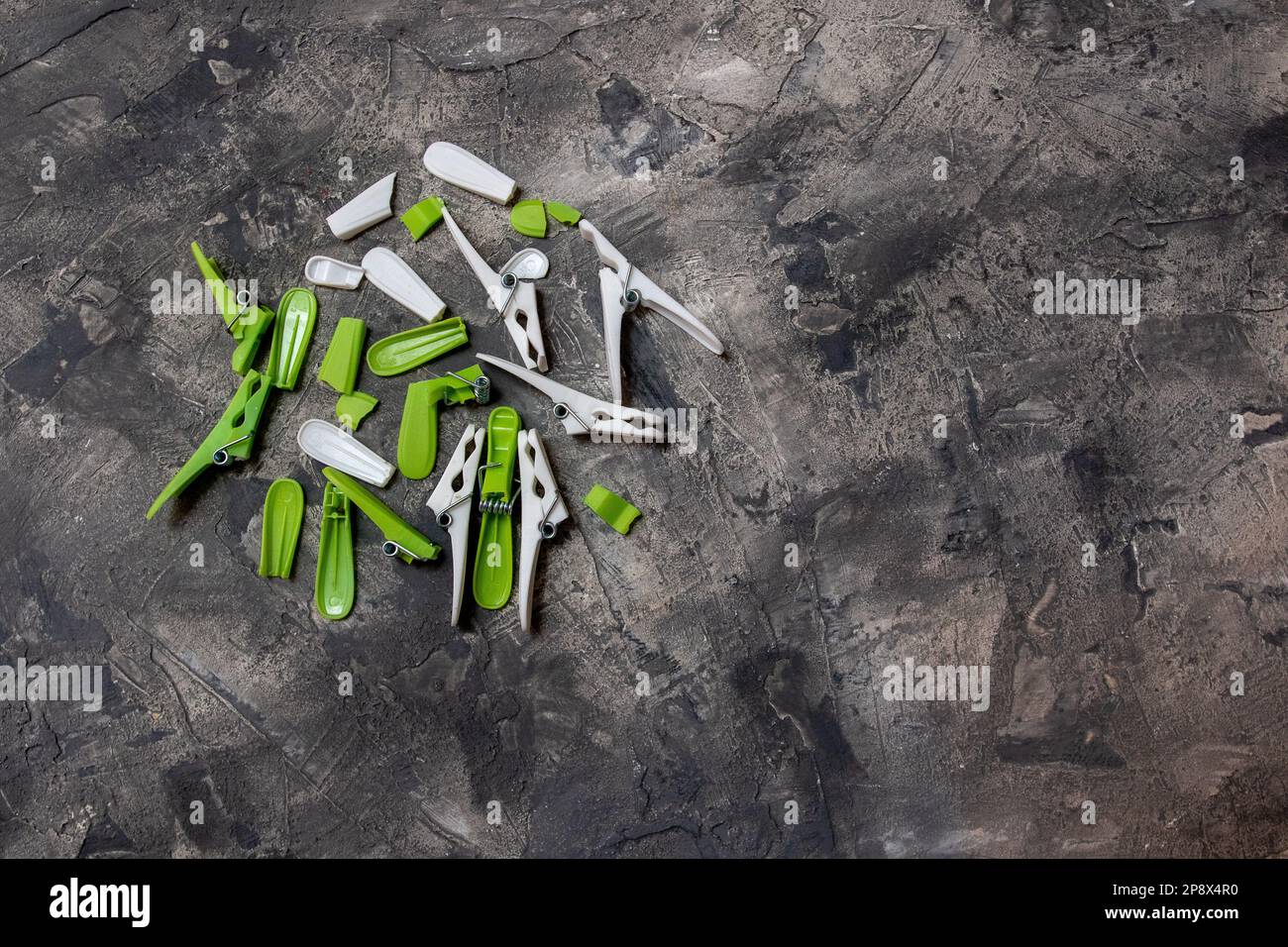 Remains of plastic clothes pegs cheaply made so they snap and break in ...