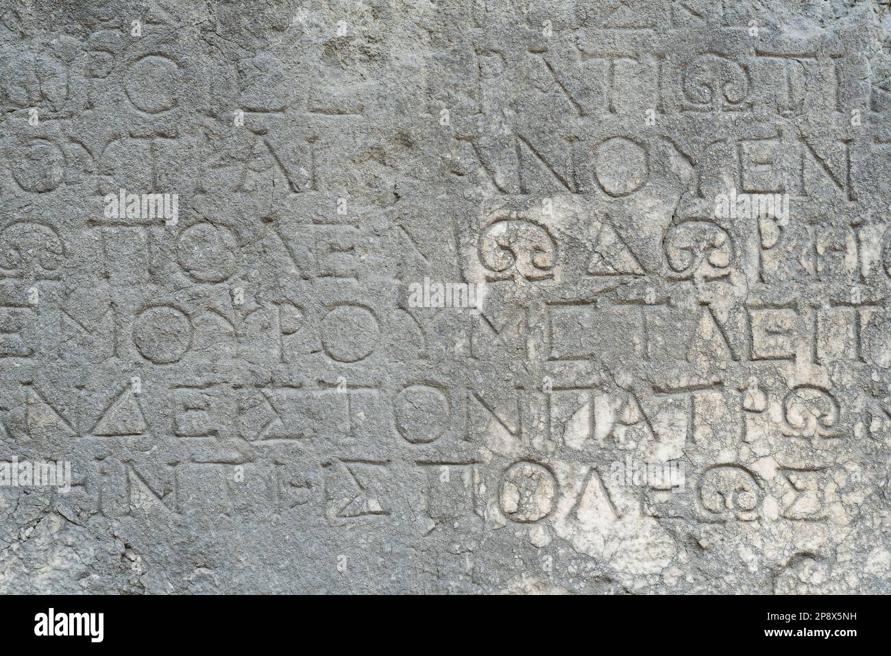 Antique inscription on a stone wall. Historic landmark in the old ...