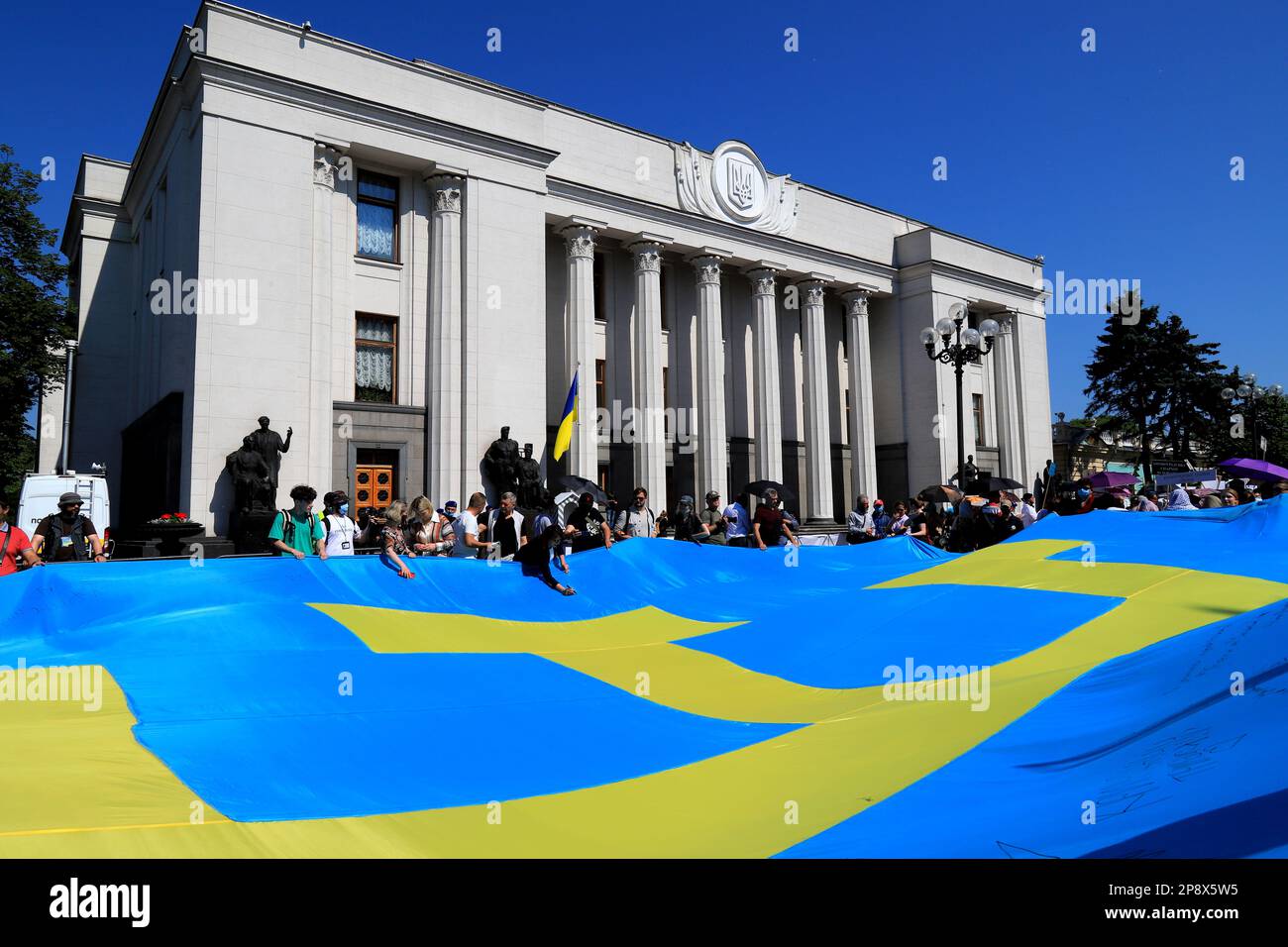 Crimean Tatar flag. Crimea is Ukraine. Patriot People hold large blue ...