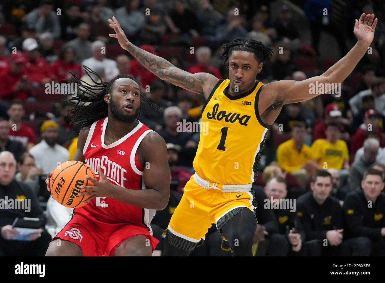 Ohio State's Bruce Thornton (2) drives the ball against Iowa's Ahron ...