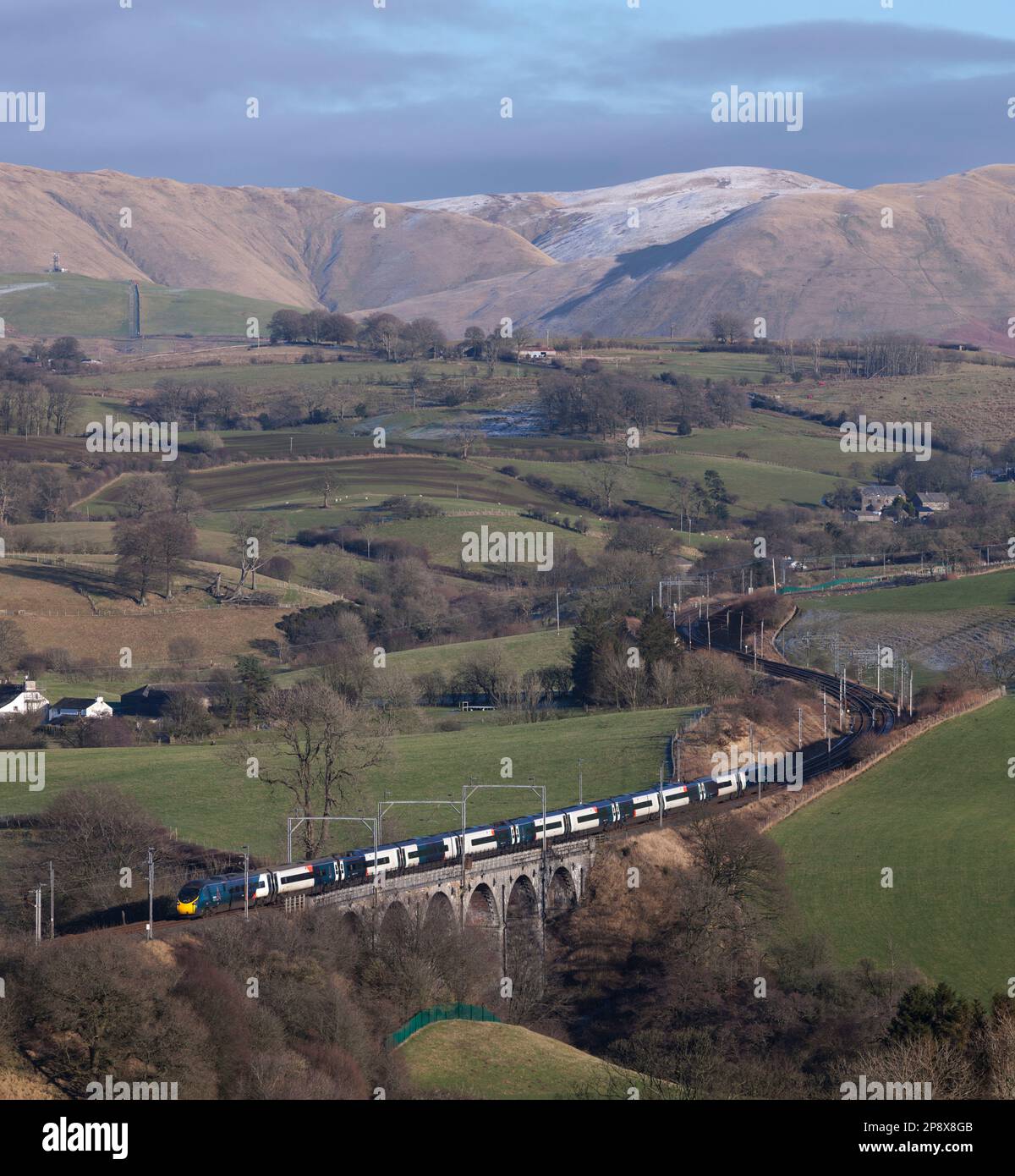 With the Howgills behind an Avanti West Coast Alstom Pendolino train ...