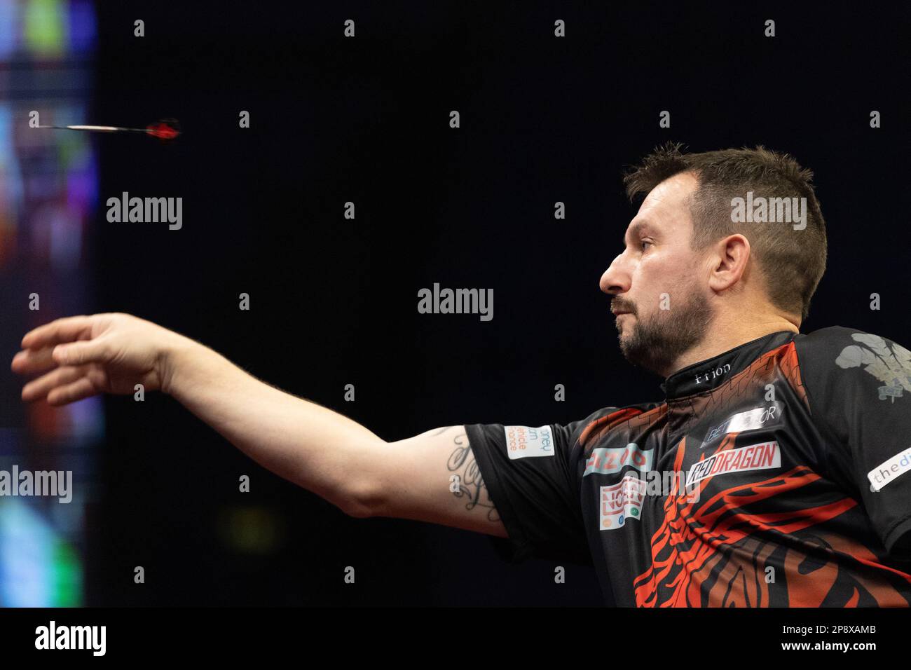 Jonny Clayton throws a dart during the 2023 Cazoo PDC Premier League ...