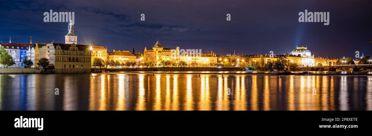 Night panoramic view of the Vltava River, Smetana Embankment, and the ...