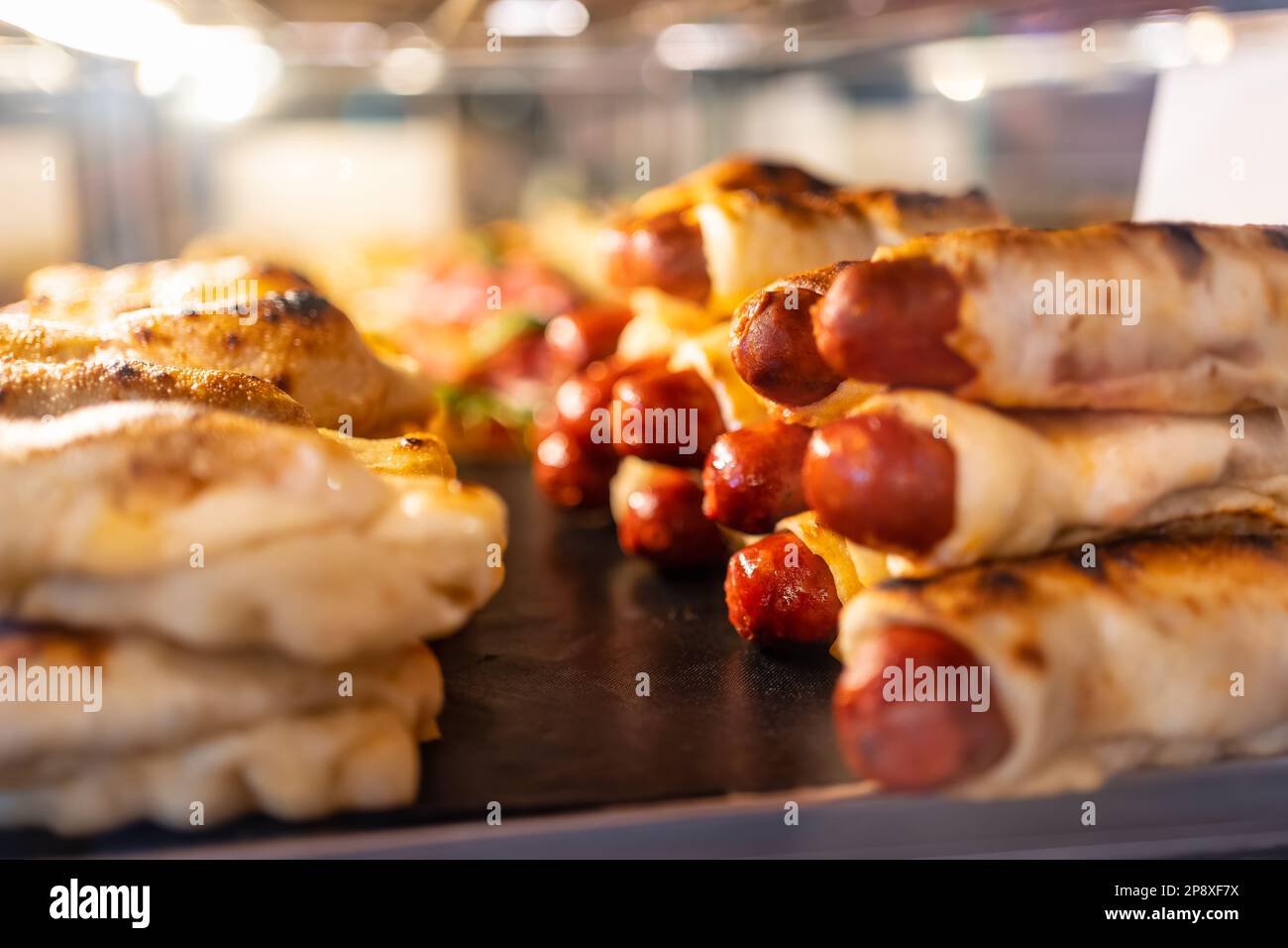 Showcase with precooked food products exposed for sale on the street ...