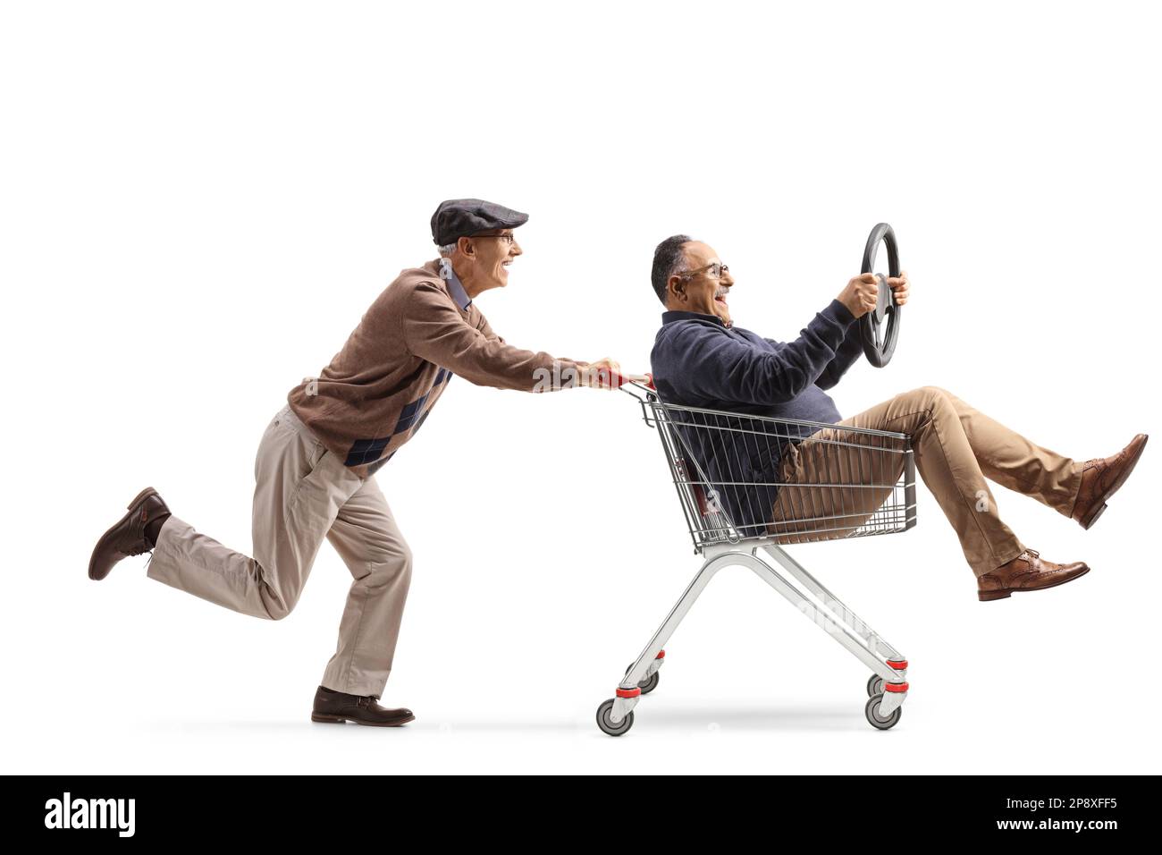 Elderly man pushing a friend inside a shopping cart holding a steering ...