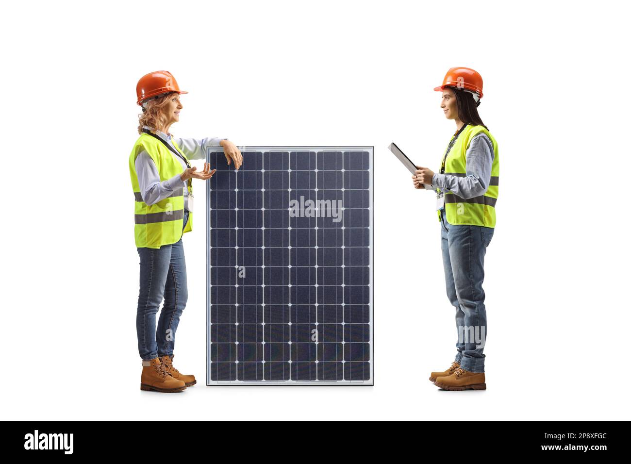 Female engineers with a photovoltaic panel isolated on white background ...