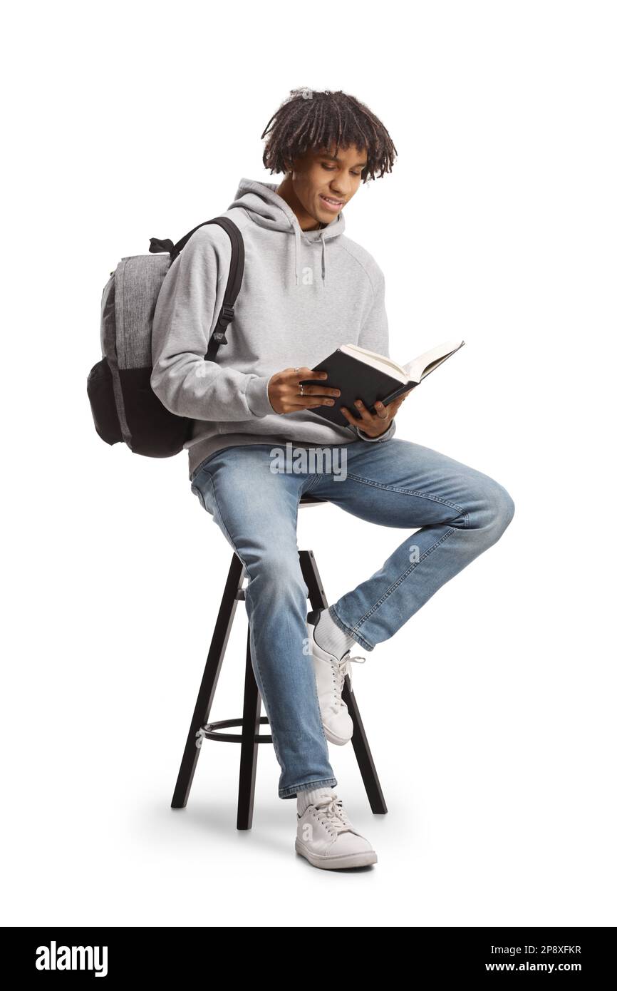 African american male student with a backpack sitting on a chair and ...