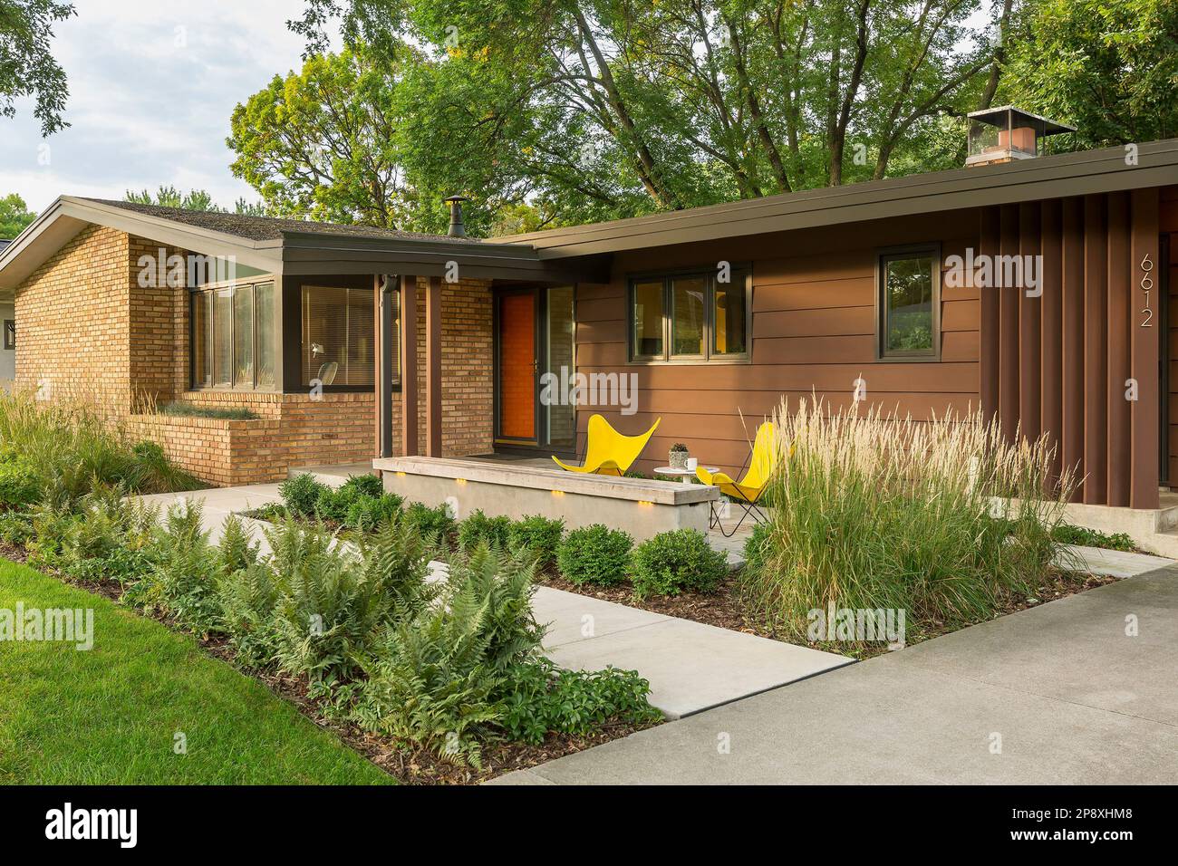 Mid century modern home with updated landscaping and patio in front hi ...