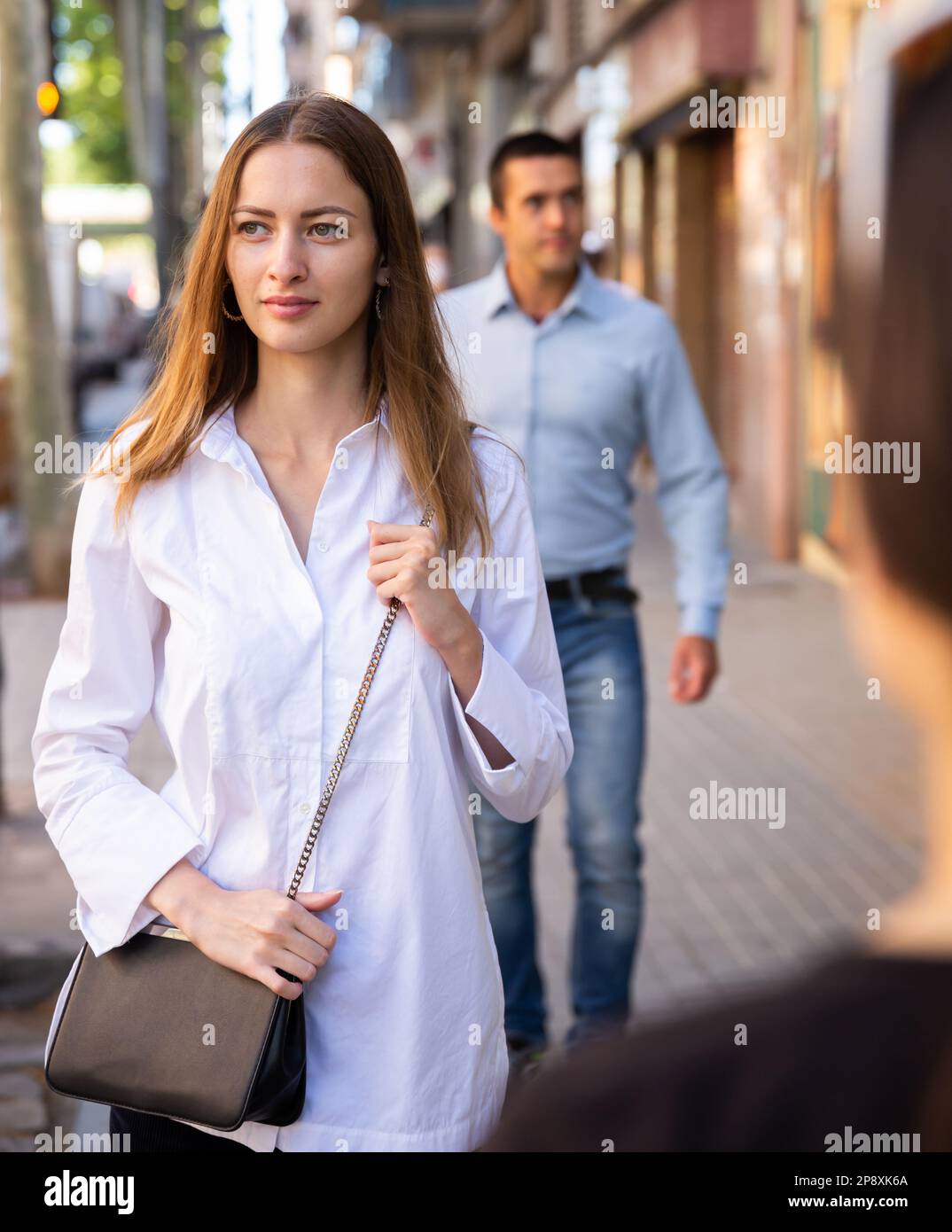 Young people walking on summer city streets Stock Photo - Alamy