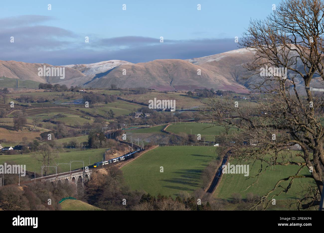 With the Howgills behind an Avanti West Coast Alstom Pendolino train ...