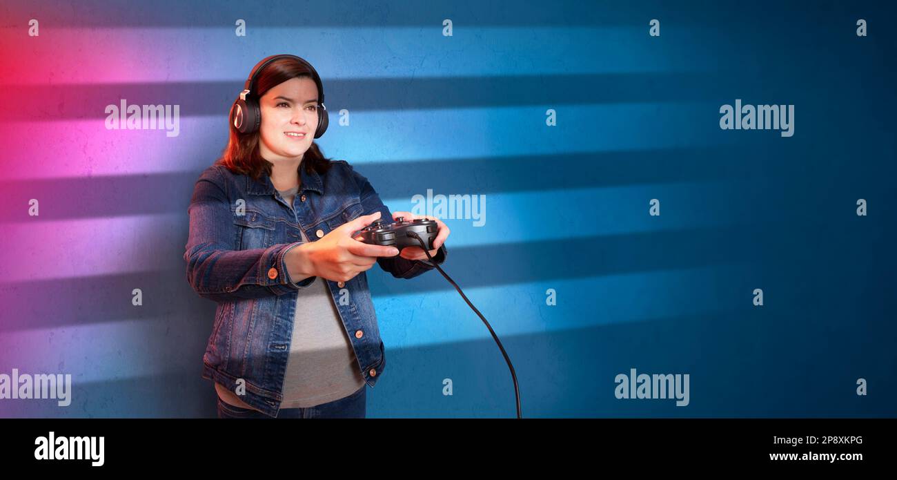 Beautiful young hispanic woman standing playing with a video game ...
