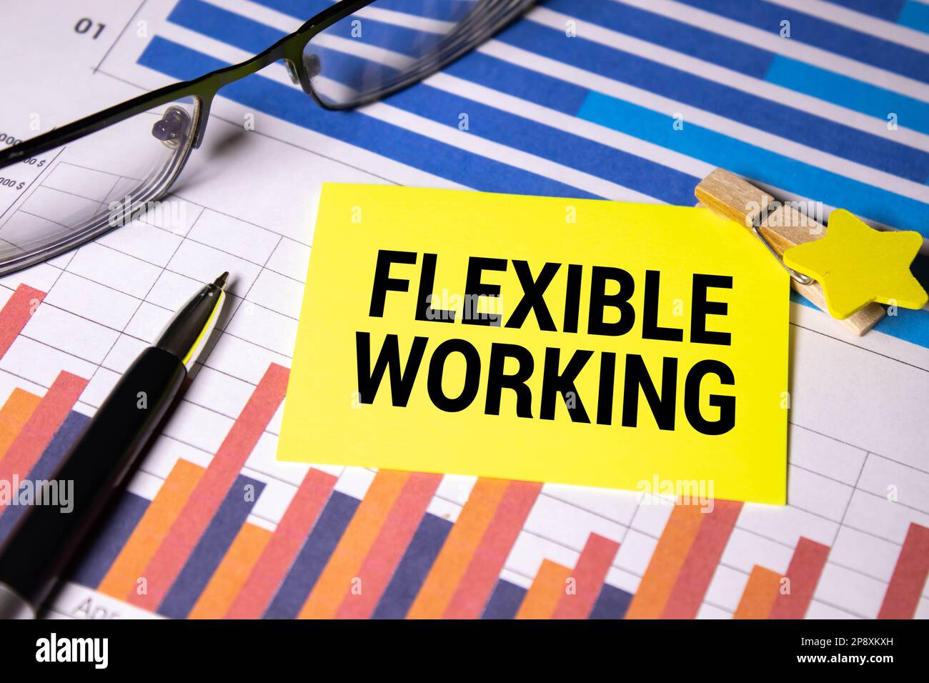 FLEXIBLE WORKING text in the office notebook with office tools ...