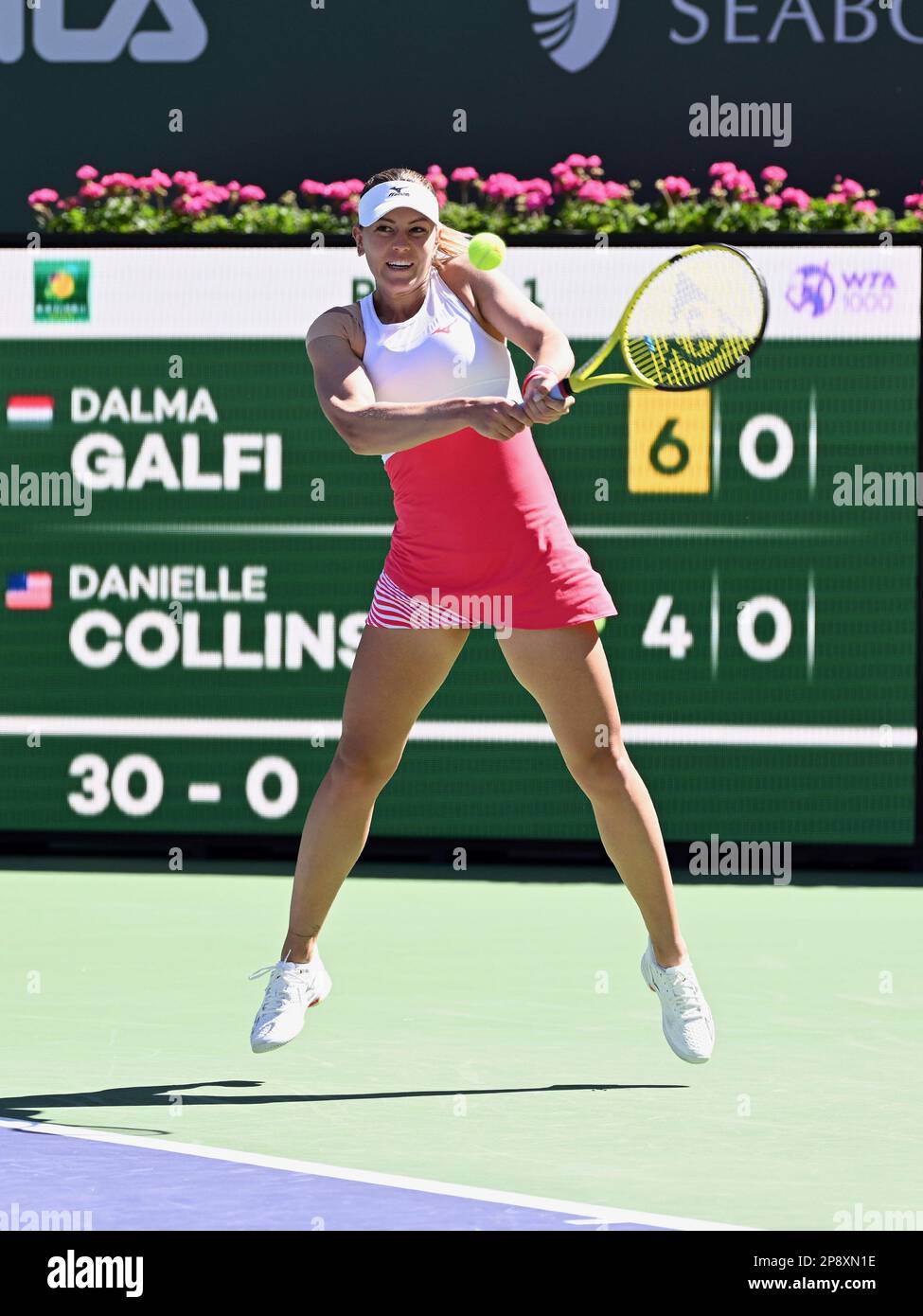 INDIAN WELLS, CA - MARCH 09: Dalma Galfi of Hungary returns the ball ...