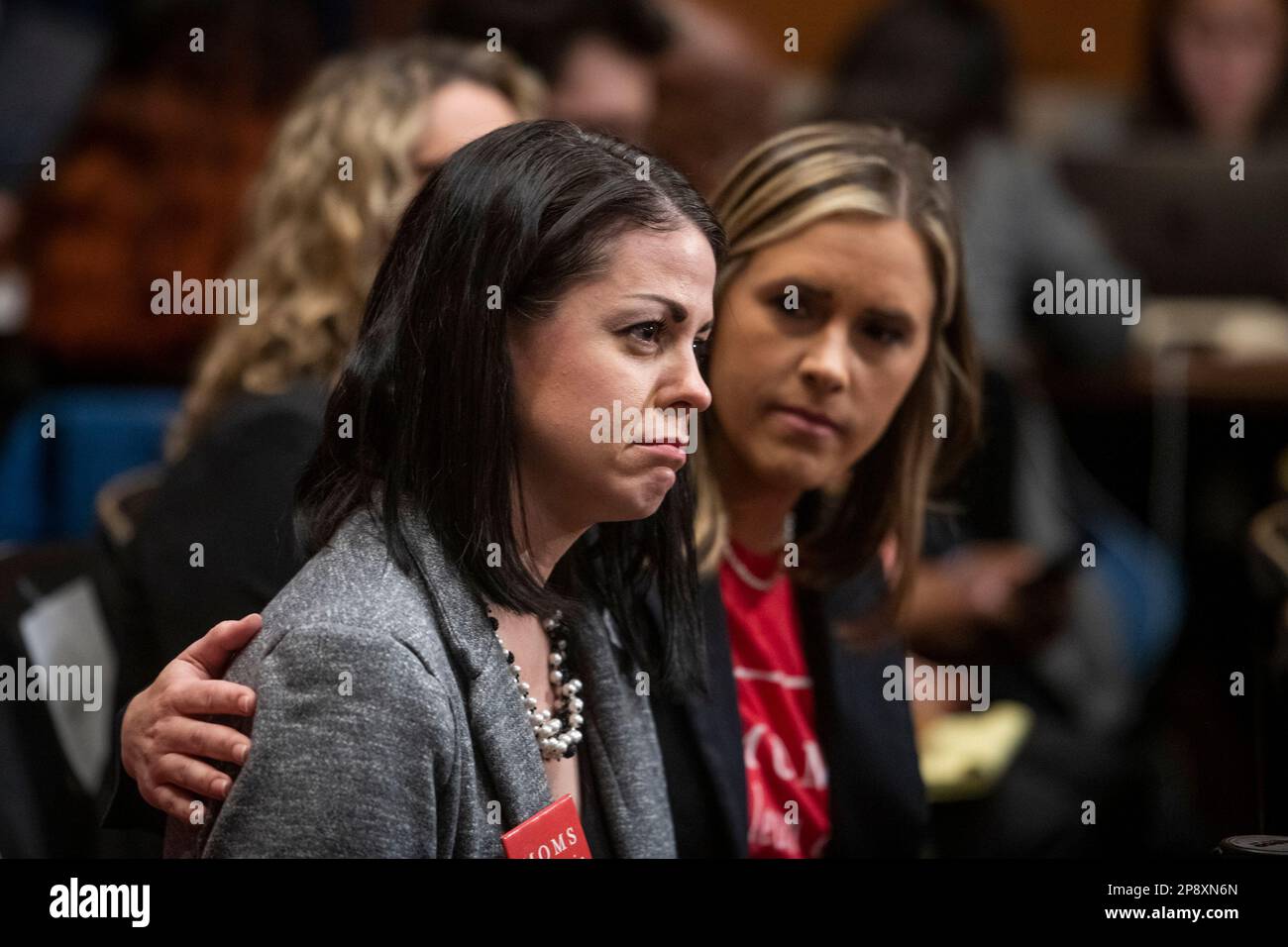East Palestine, Ohio resident Misti Allison, left, is comforted by ...