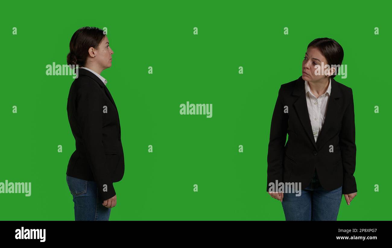 Stylish businesswoman wearing formal suit in studio, standing and ...