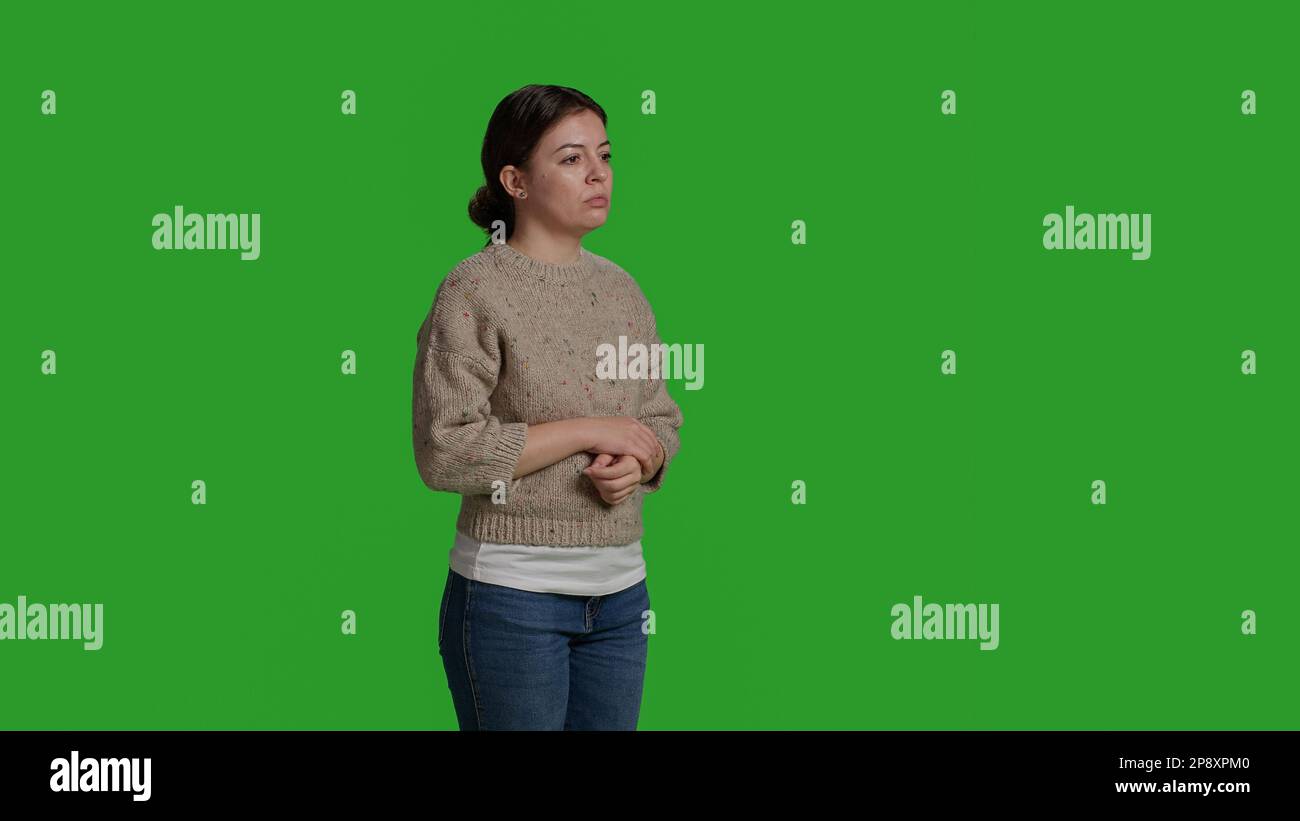 Side view of person running late and checking time on wristwatch, being ...
