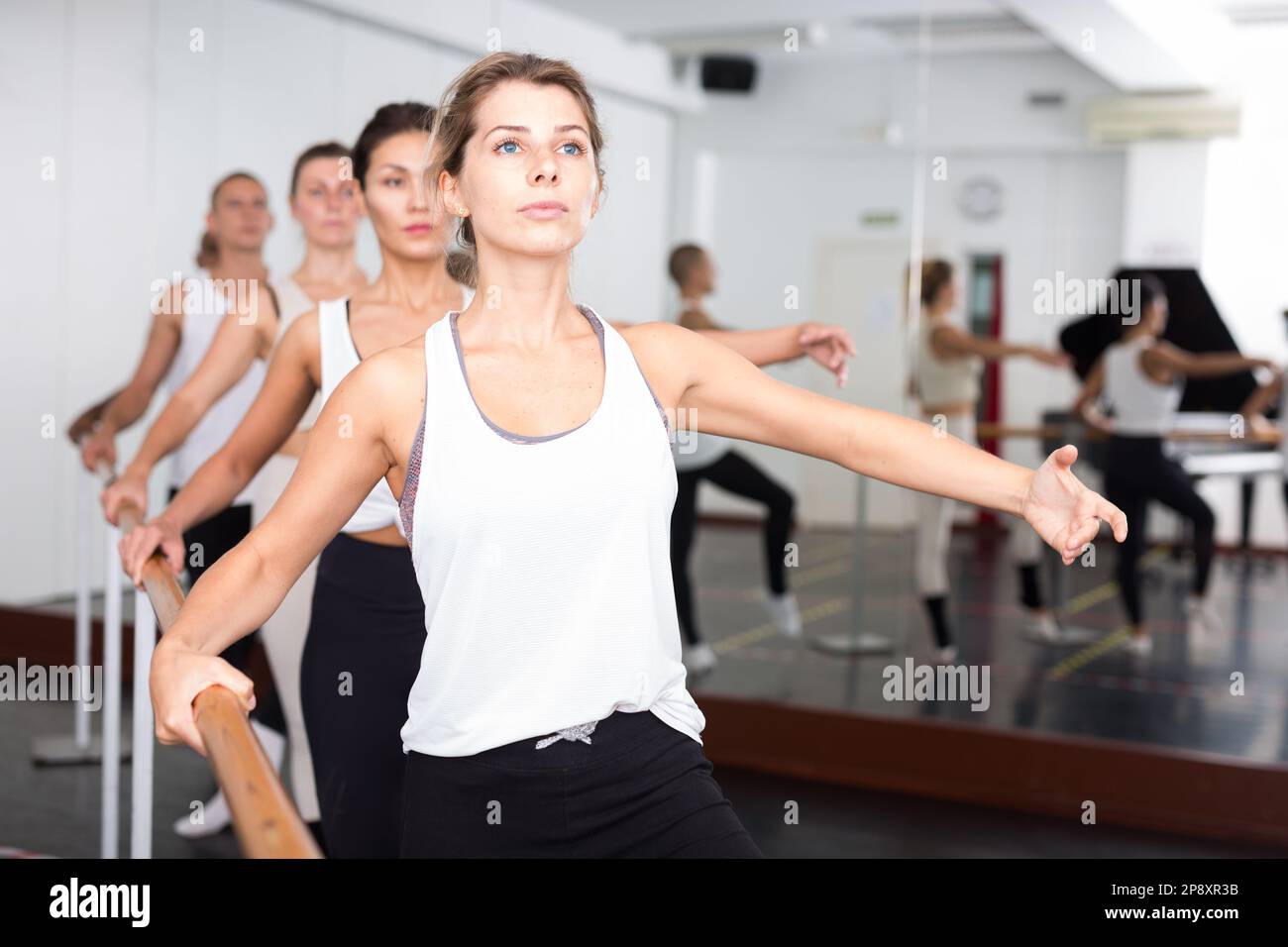 Warm-up sessions at bench, women and men doing ballet Stock Photo - Alamy