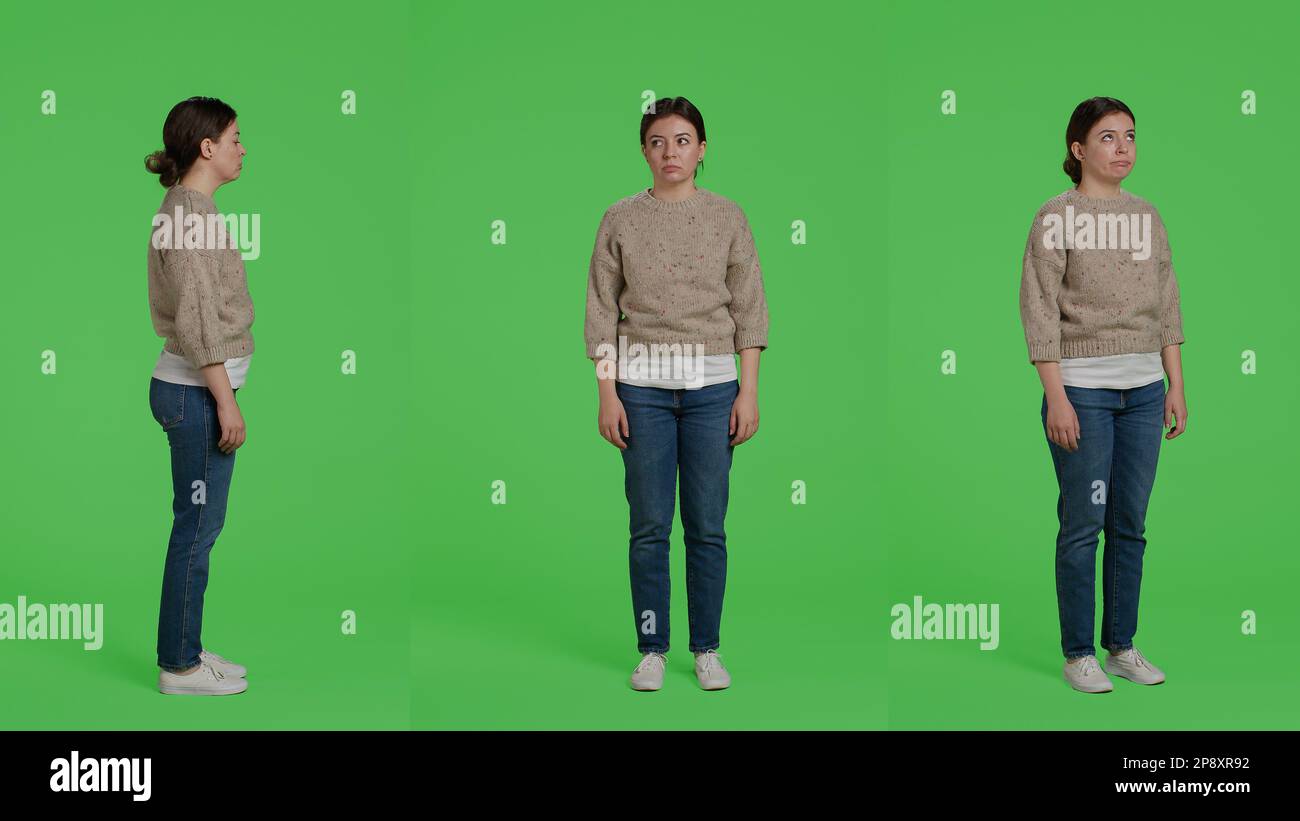 Sad displeased woman standing over full body backdrop with greenscreen ...