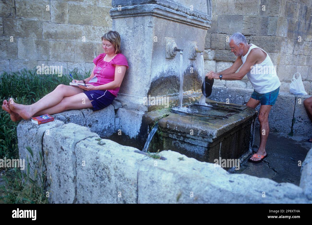 Pilgrims and fountain. Hontanas.Burgos province. Spain. Camino de ...