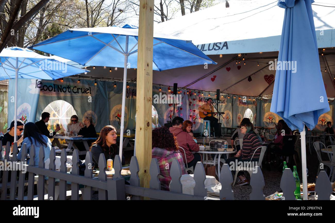 CHARLOTTE, NC-5 MARCH 2023: Covered outside dining with musician at the ...