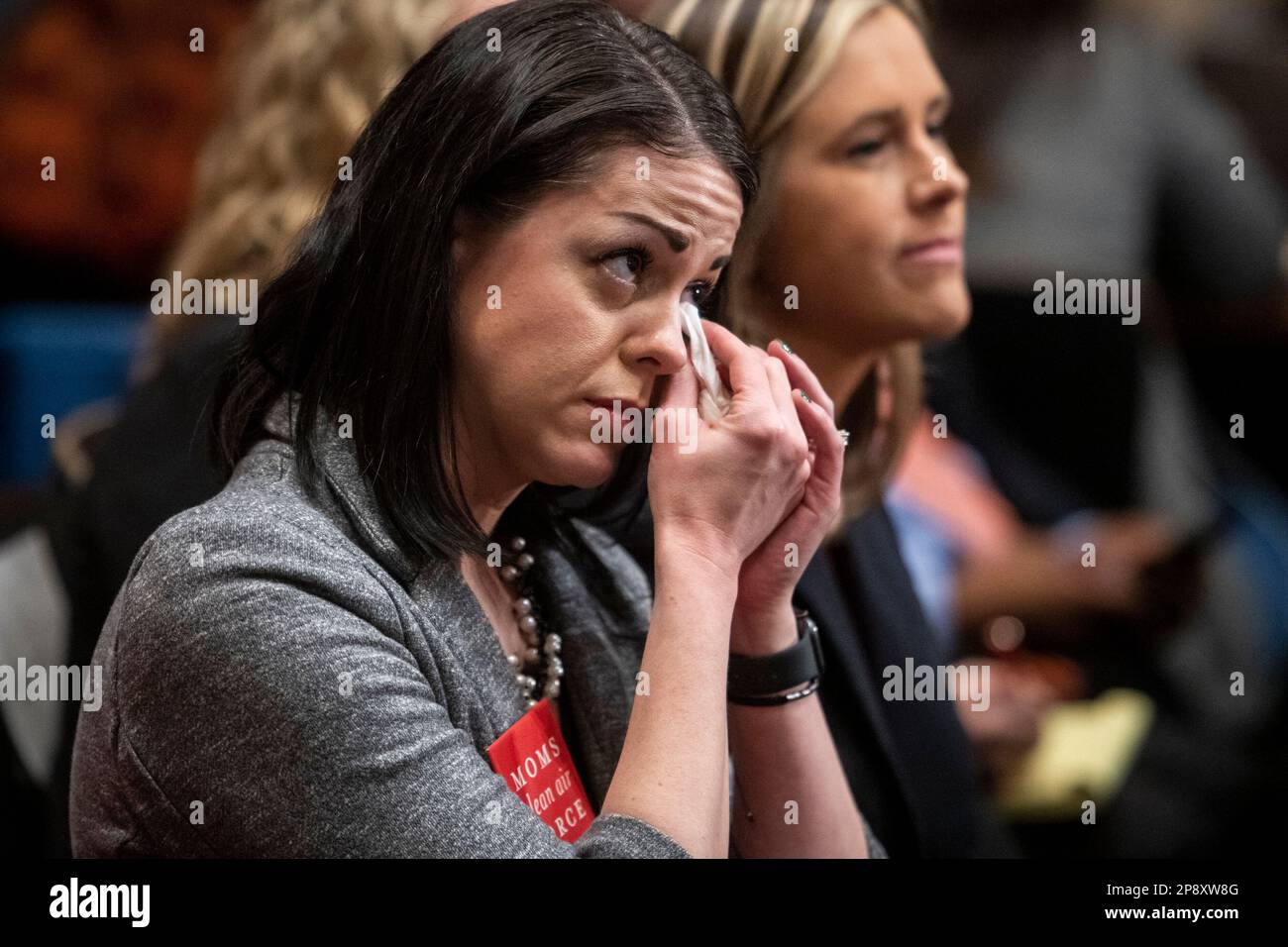 East Palestine, Ohio resident Misti Allison wipes tears from her eyes ...